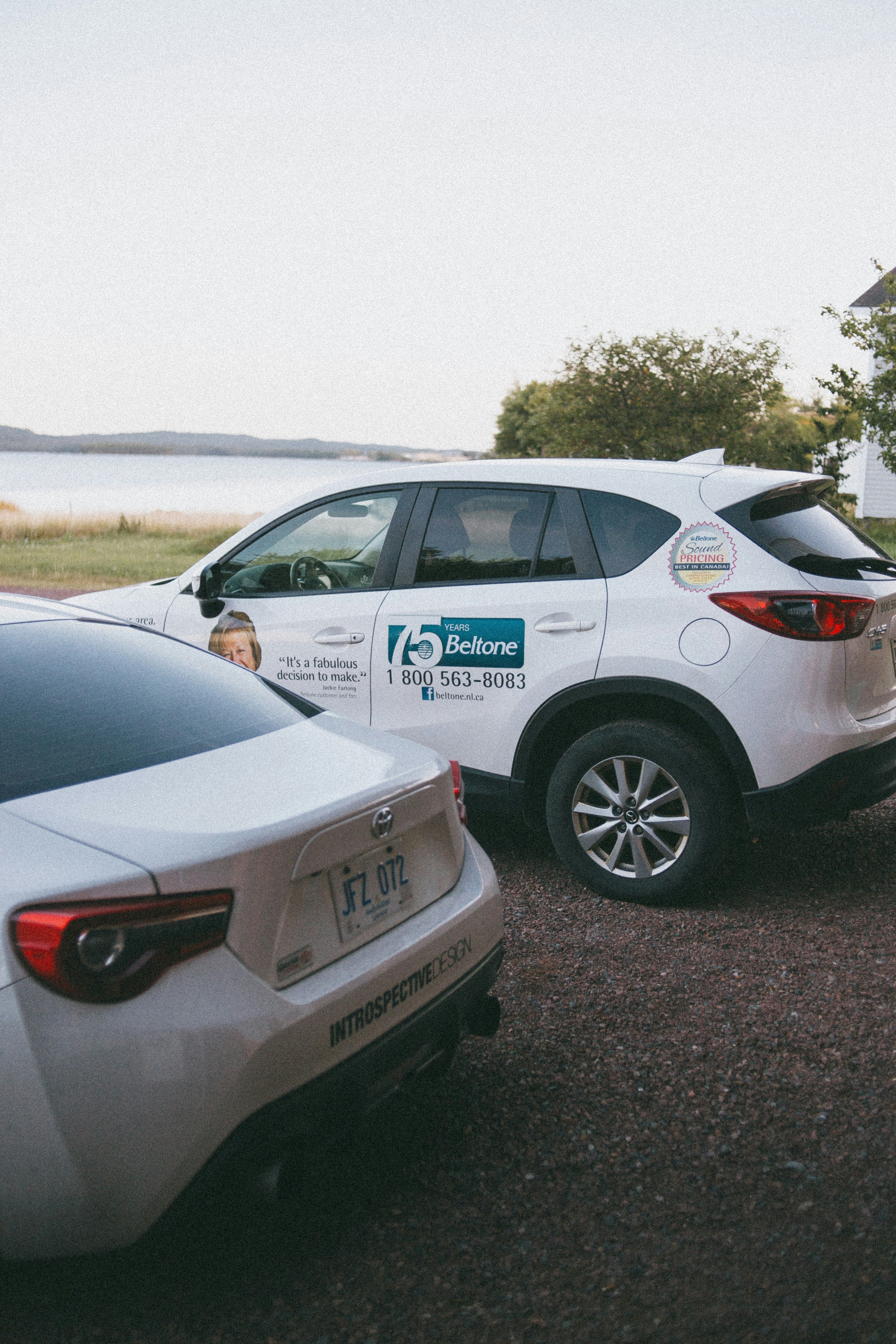 Shoreline Branding: The Beltone SUV by a Quiet Lakeside Parking Lot