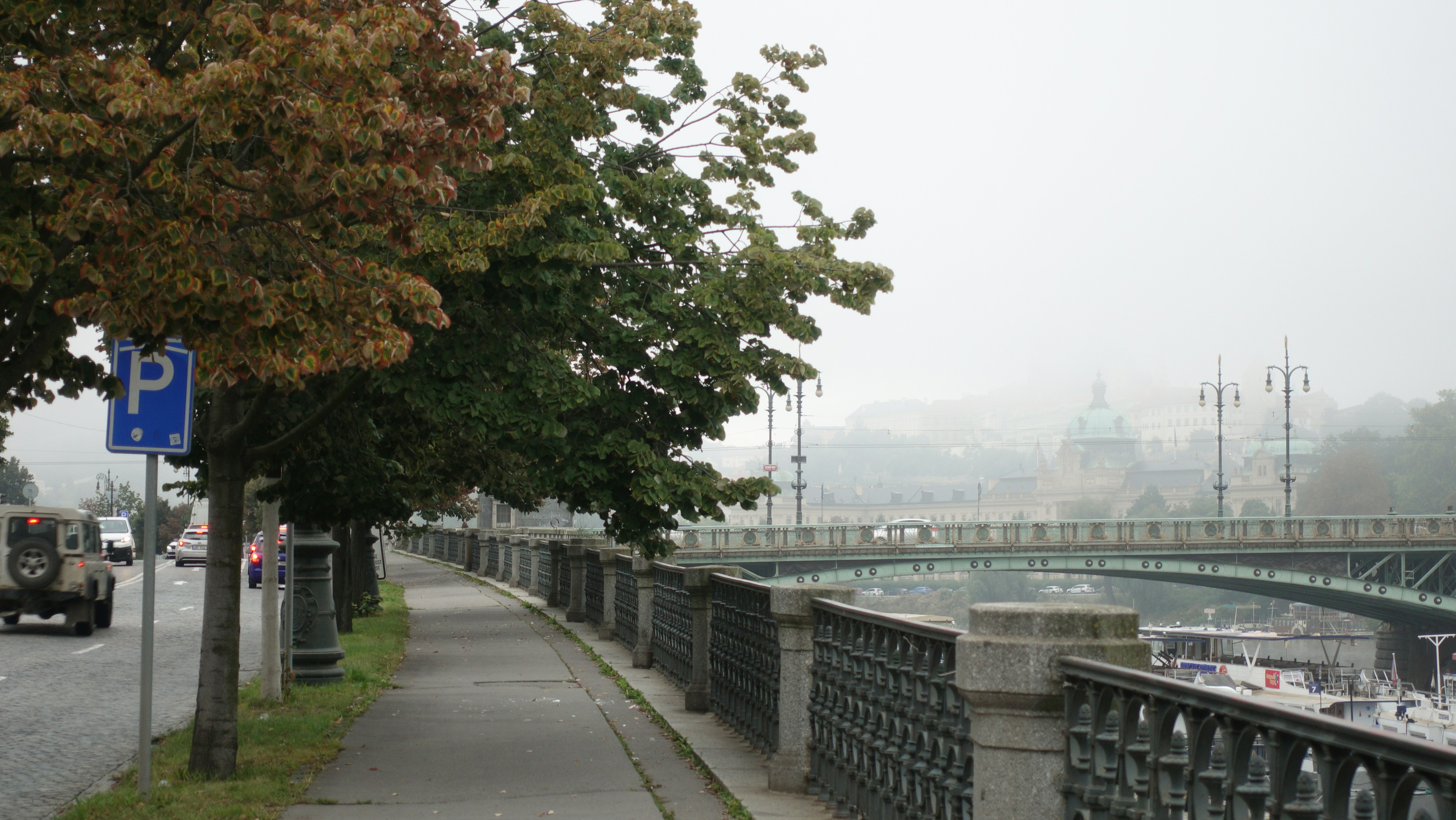 Riverside Mist: Fog-Softened Walk Toward the Distant Bridge