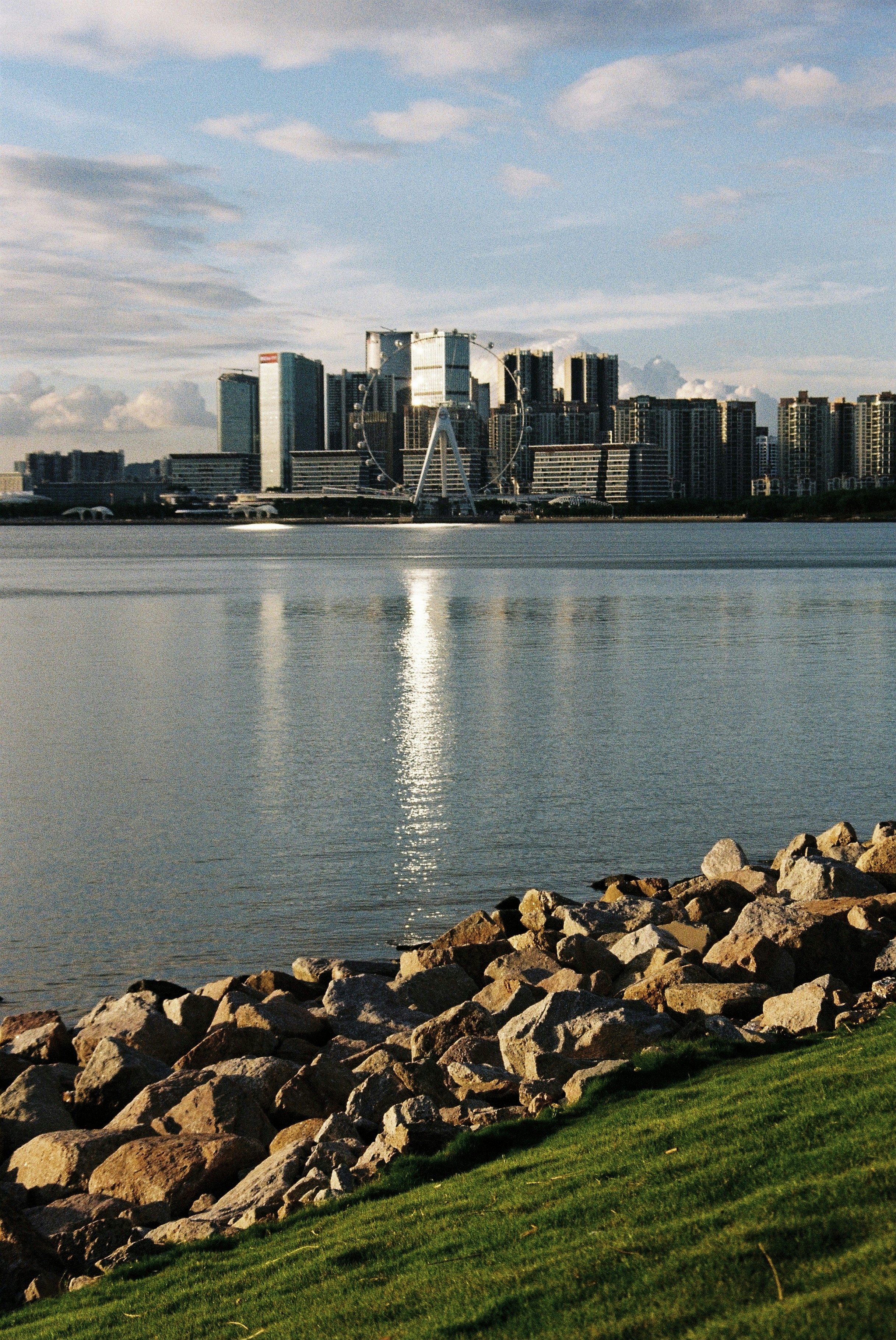 Harbor Glass: Modern Skyline Reflected on Still Waters