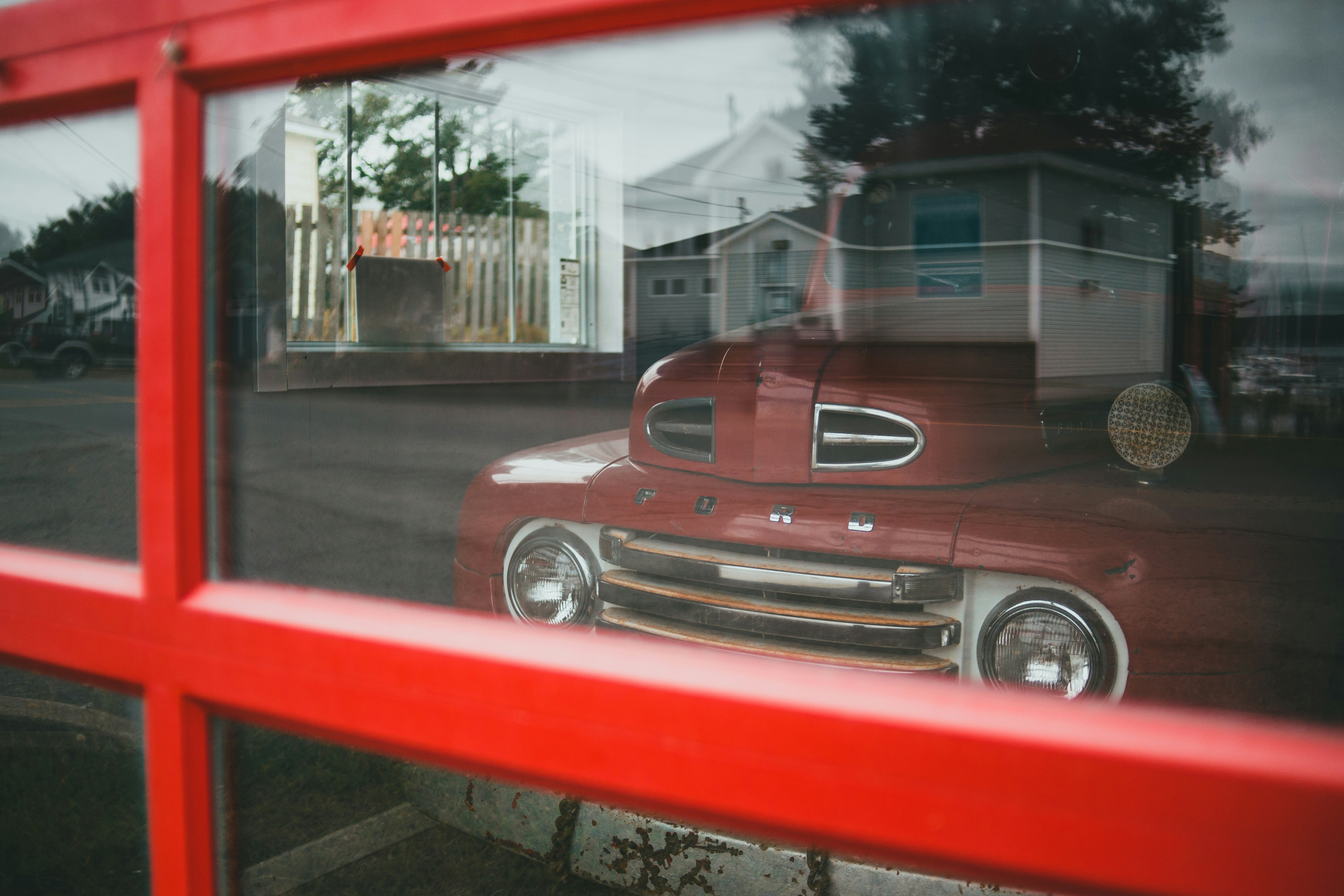 red chevrolet camaro on road during daytime
