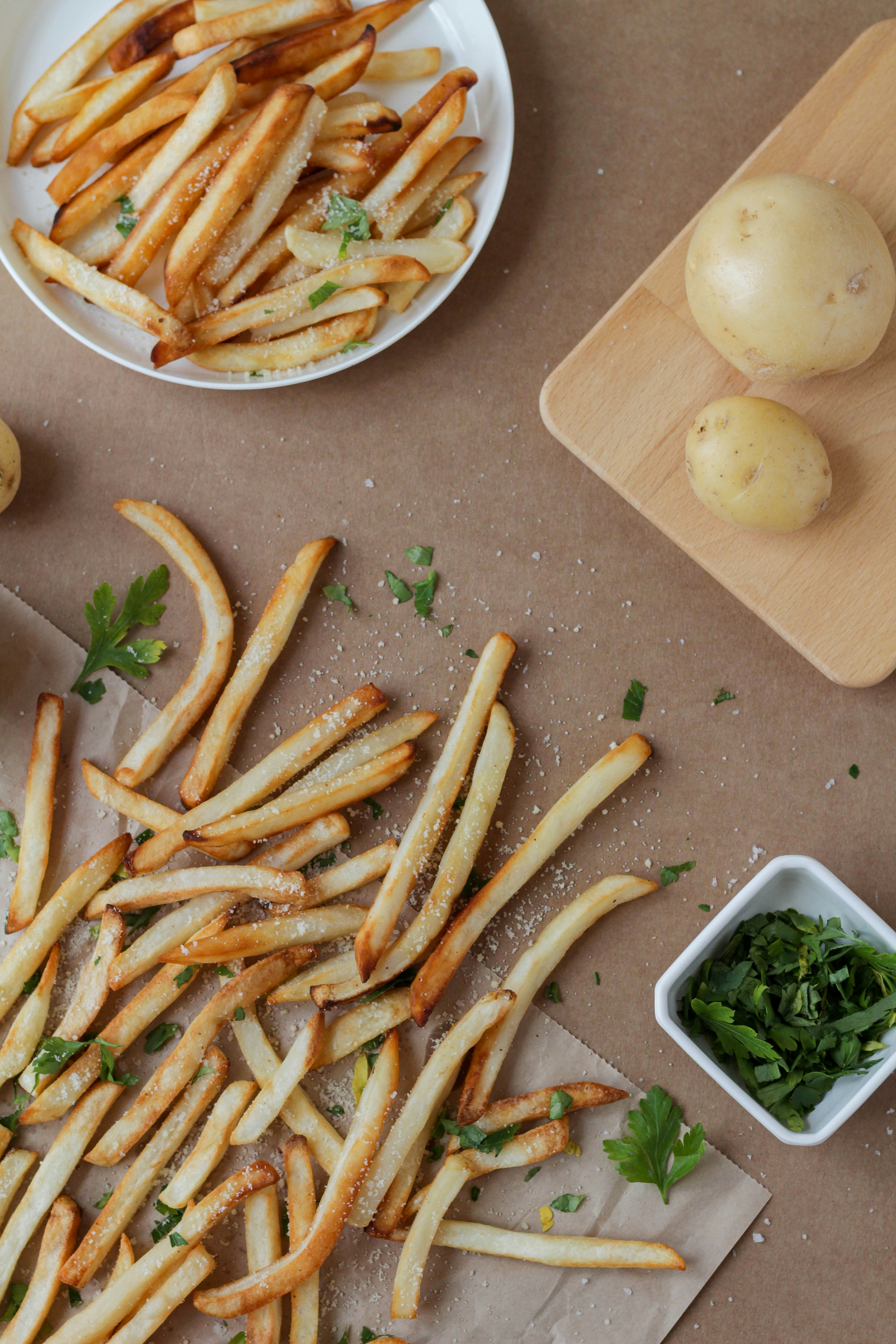 Fries on a Rustic Spread: Golden Crisps and Fresh Herbs