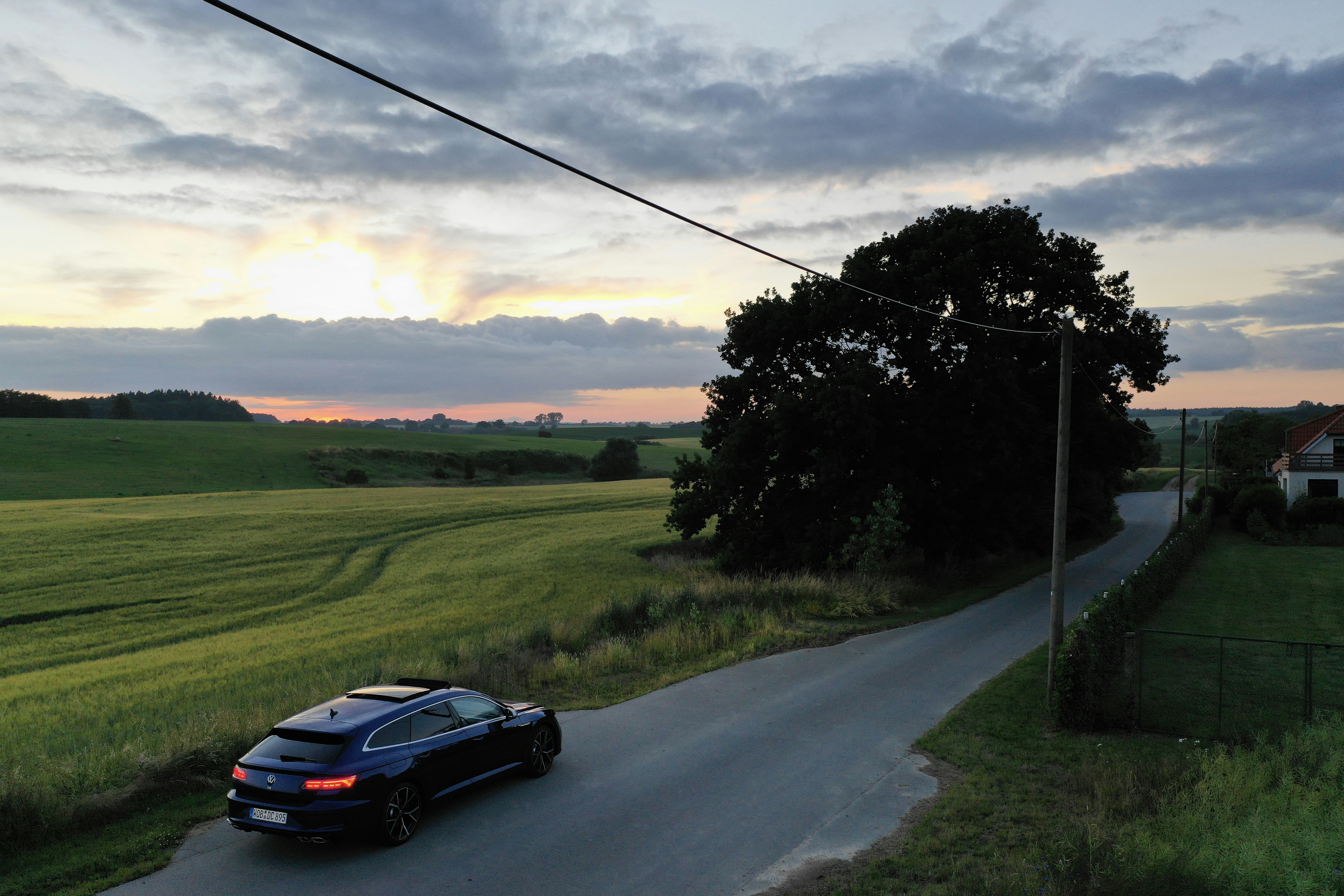 Twilight Drive Through Verdant Fields