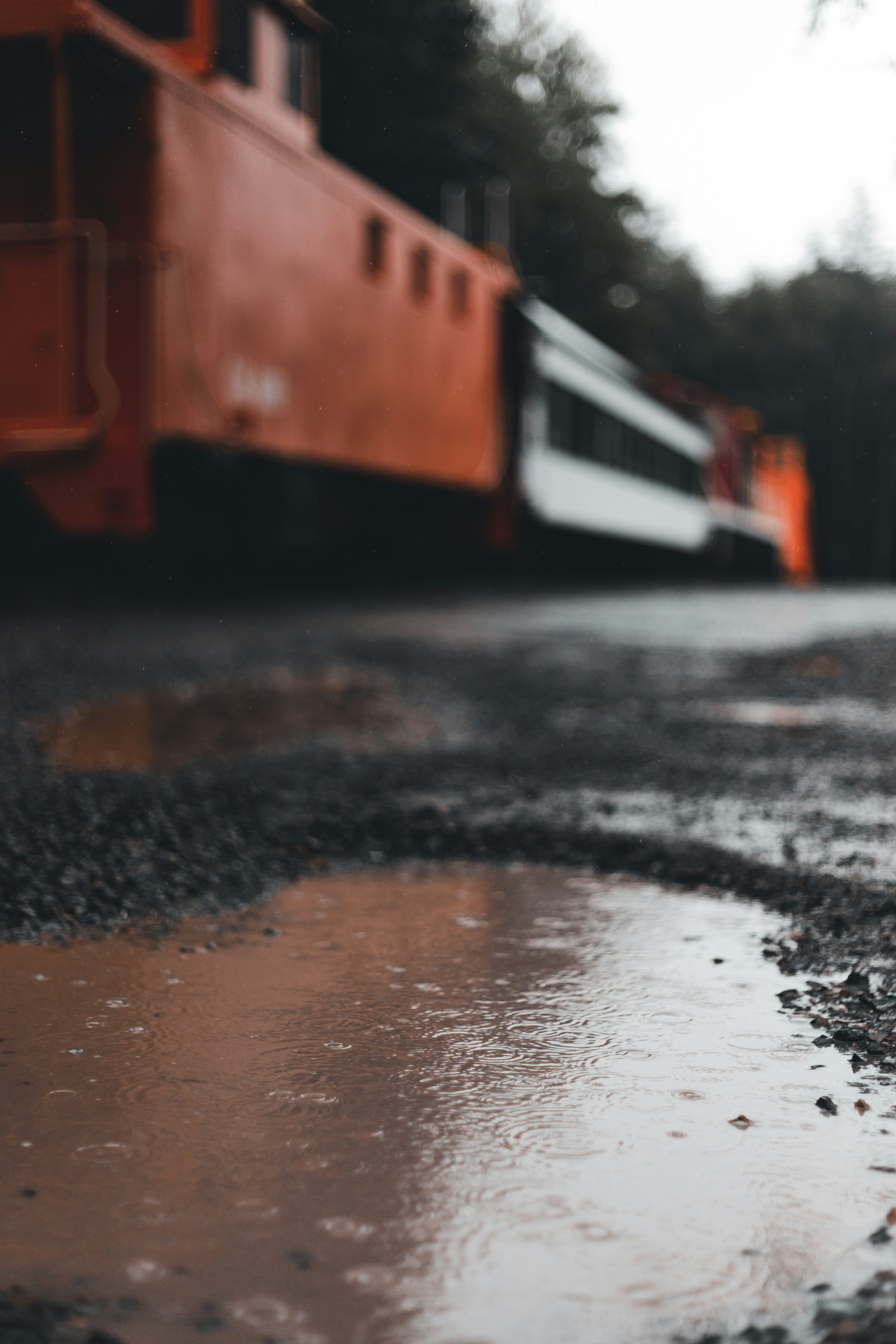 Low Angle of a Raft of Rails: Rainy Puddle in the Train Yard