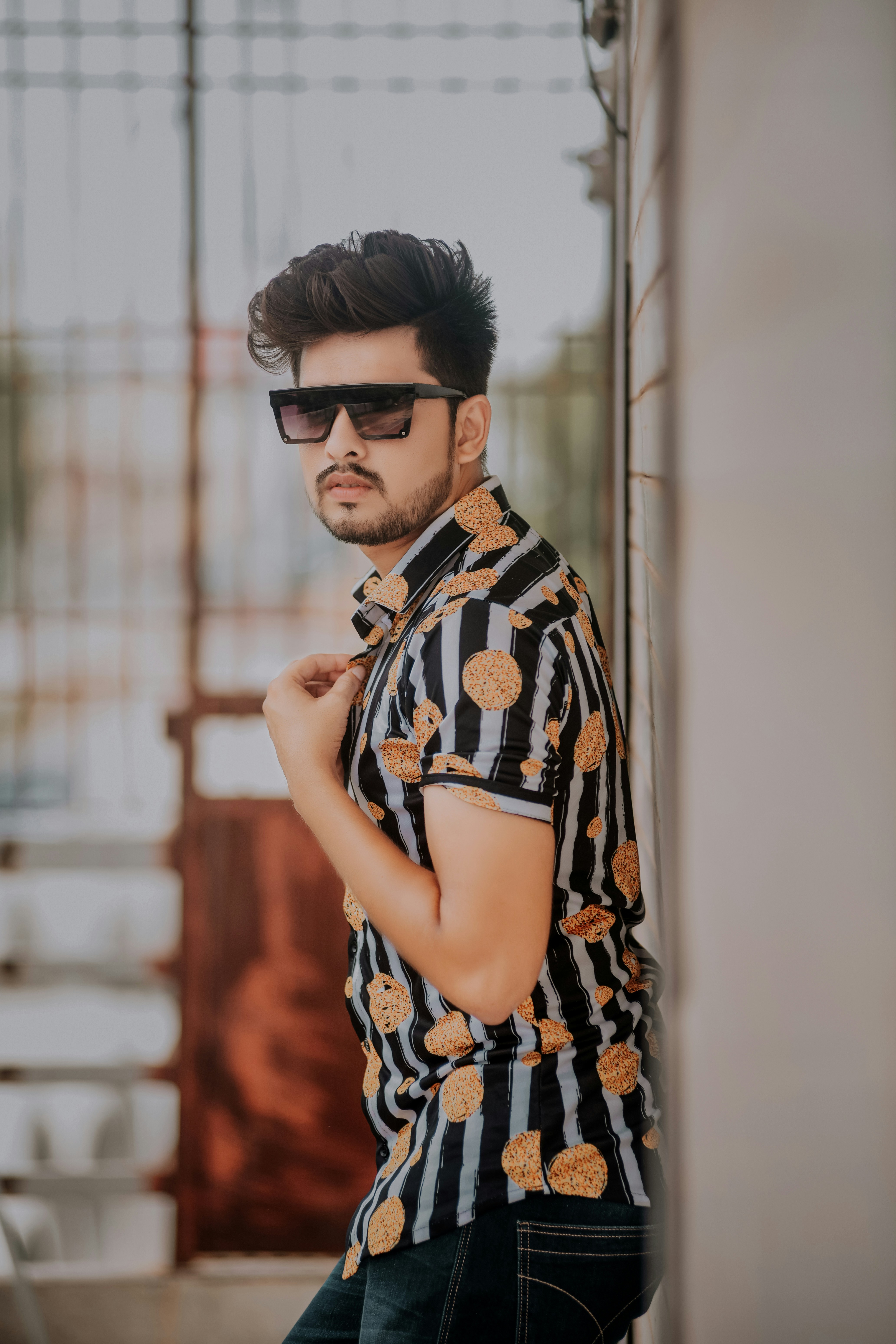 Urban Gaze in Stripes: A Quiet Portrait on the Edge