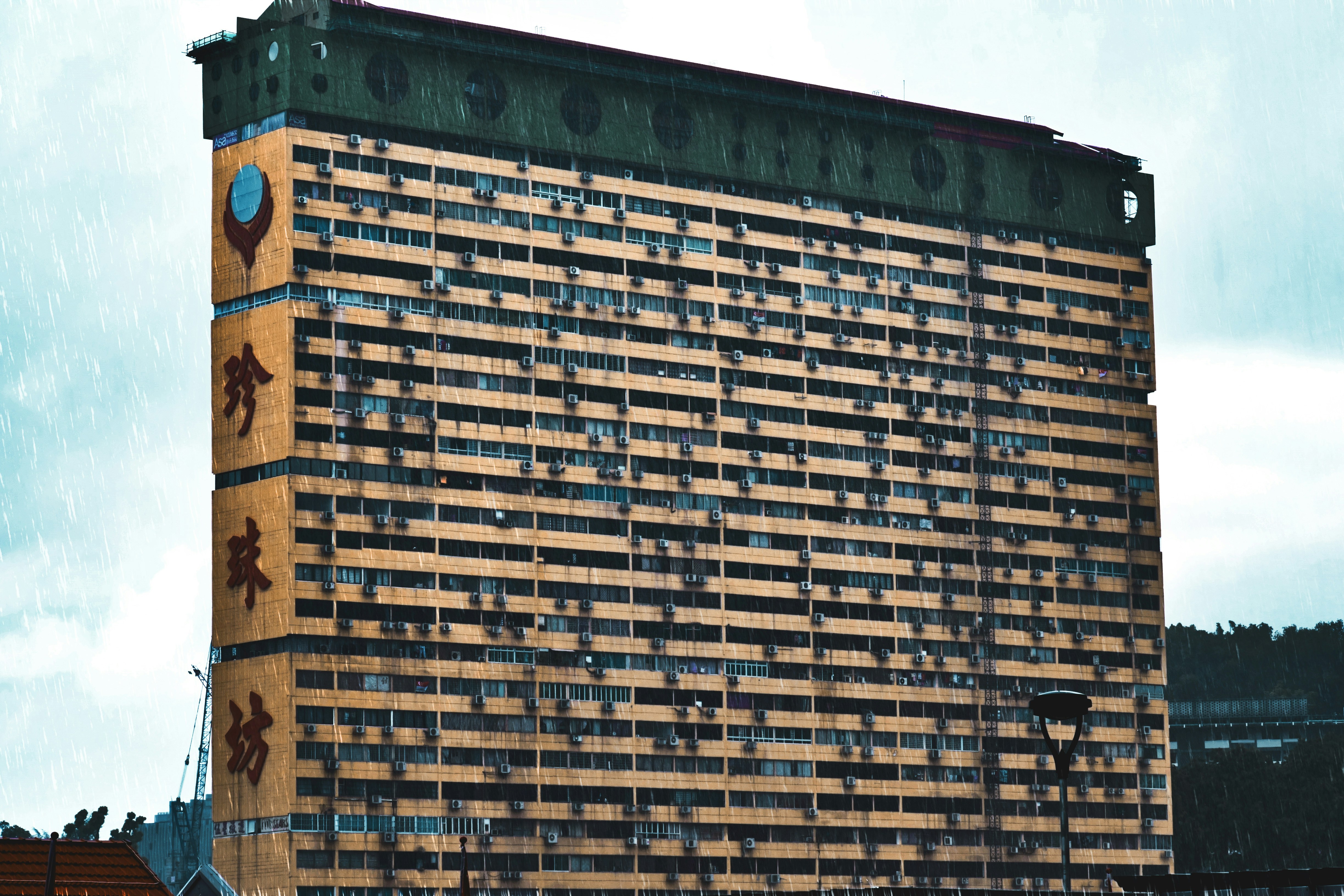 Monolithic Facade in Rain: A Grid of Windows