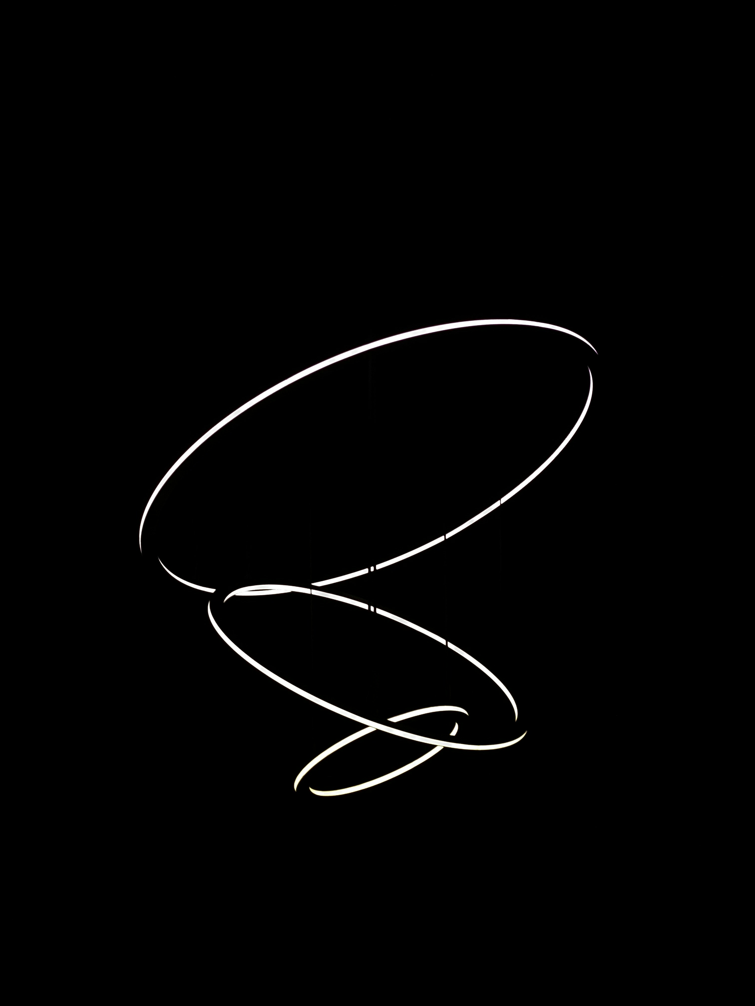 Coiling Light in Negative Space: A Minimalist White Spiral on Black