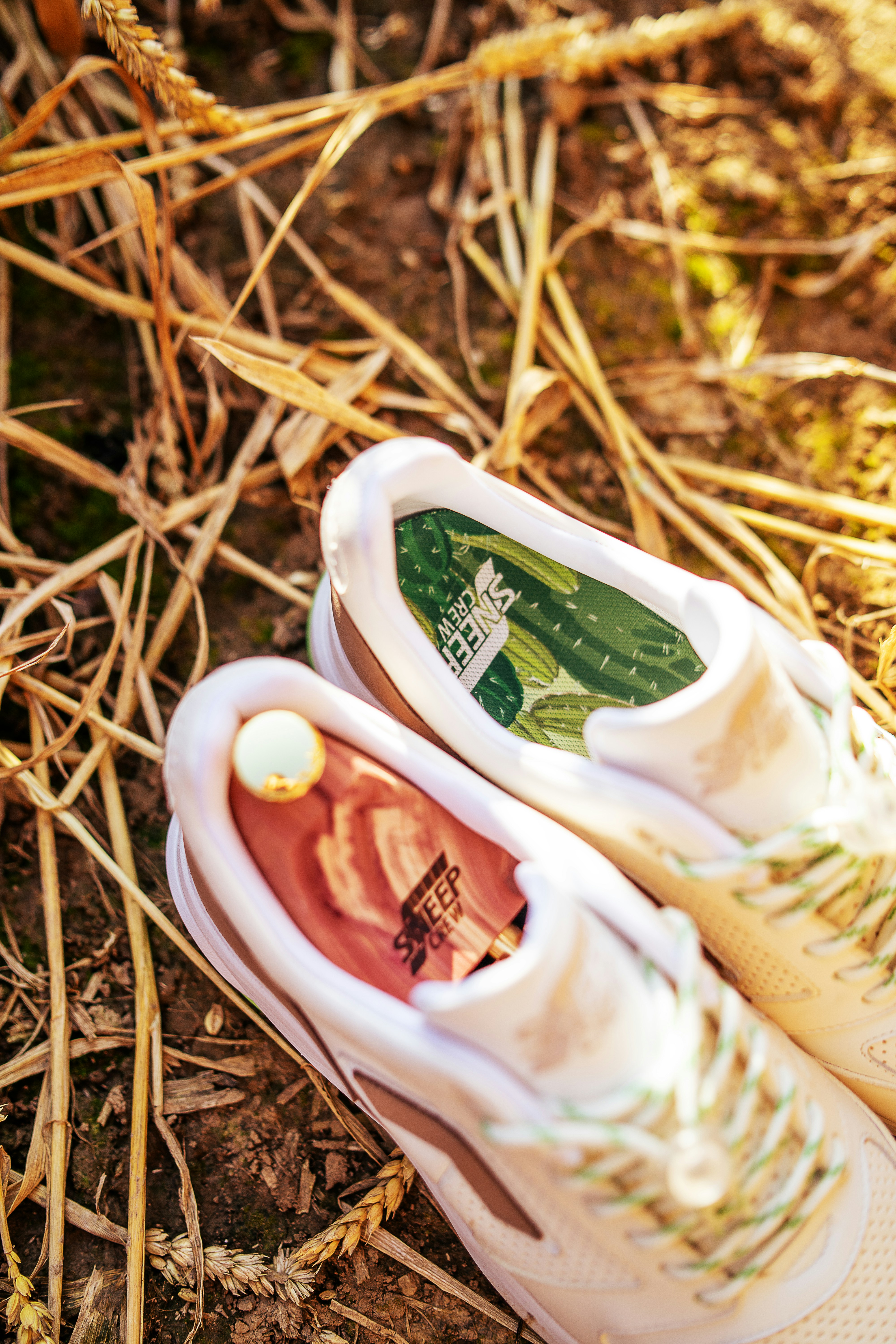 Leafy Linings in the Grass: White Sneakers with Bold Insoles