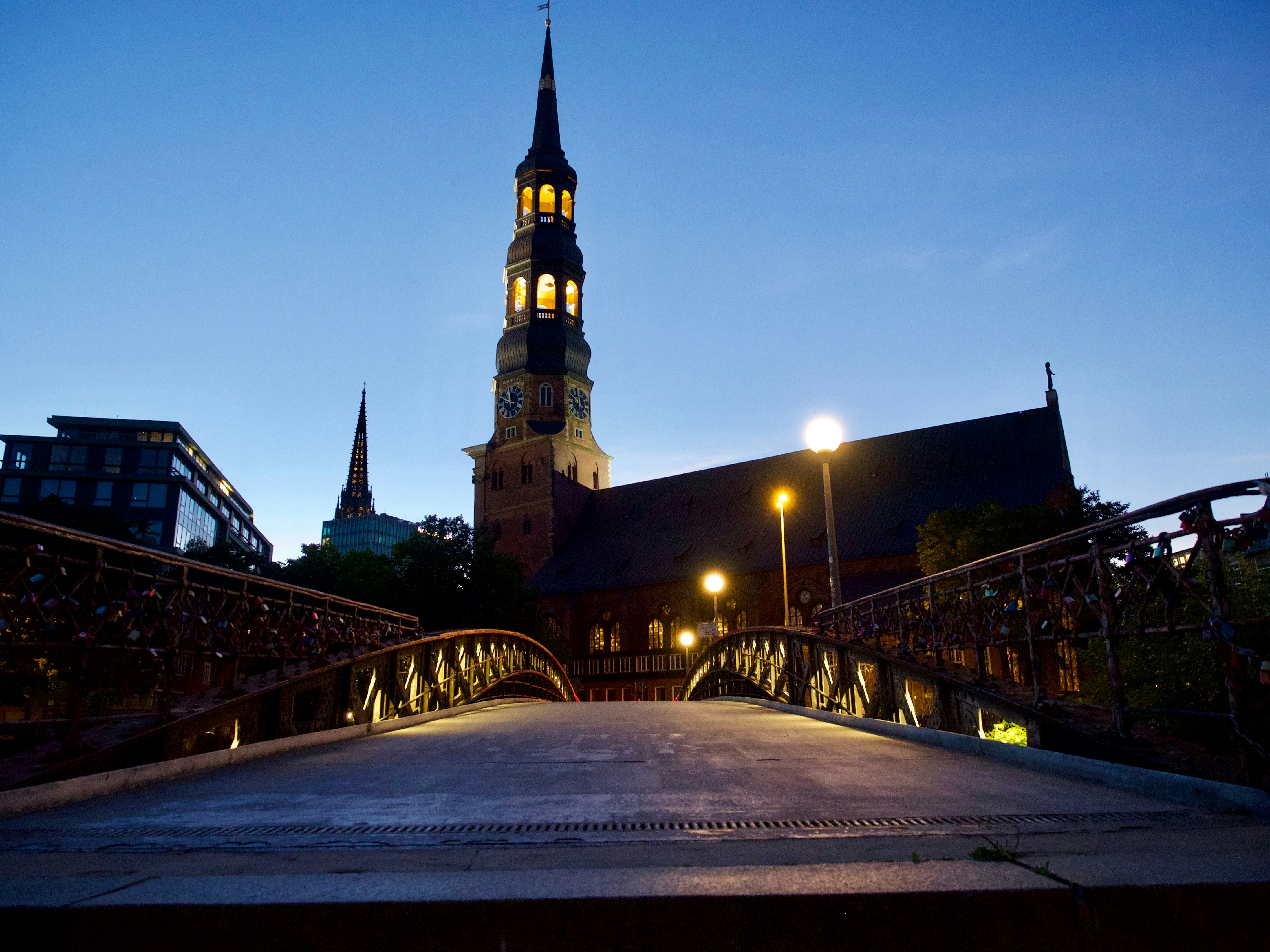 brown bridge with lights during night time