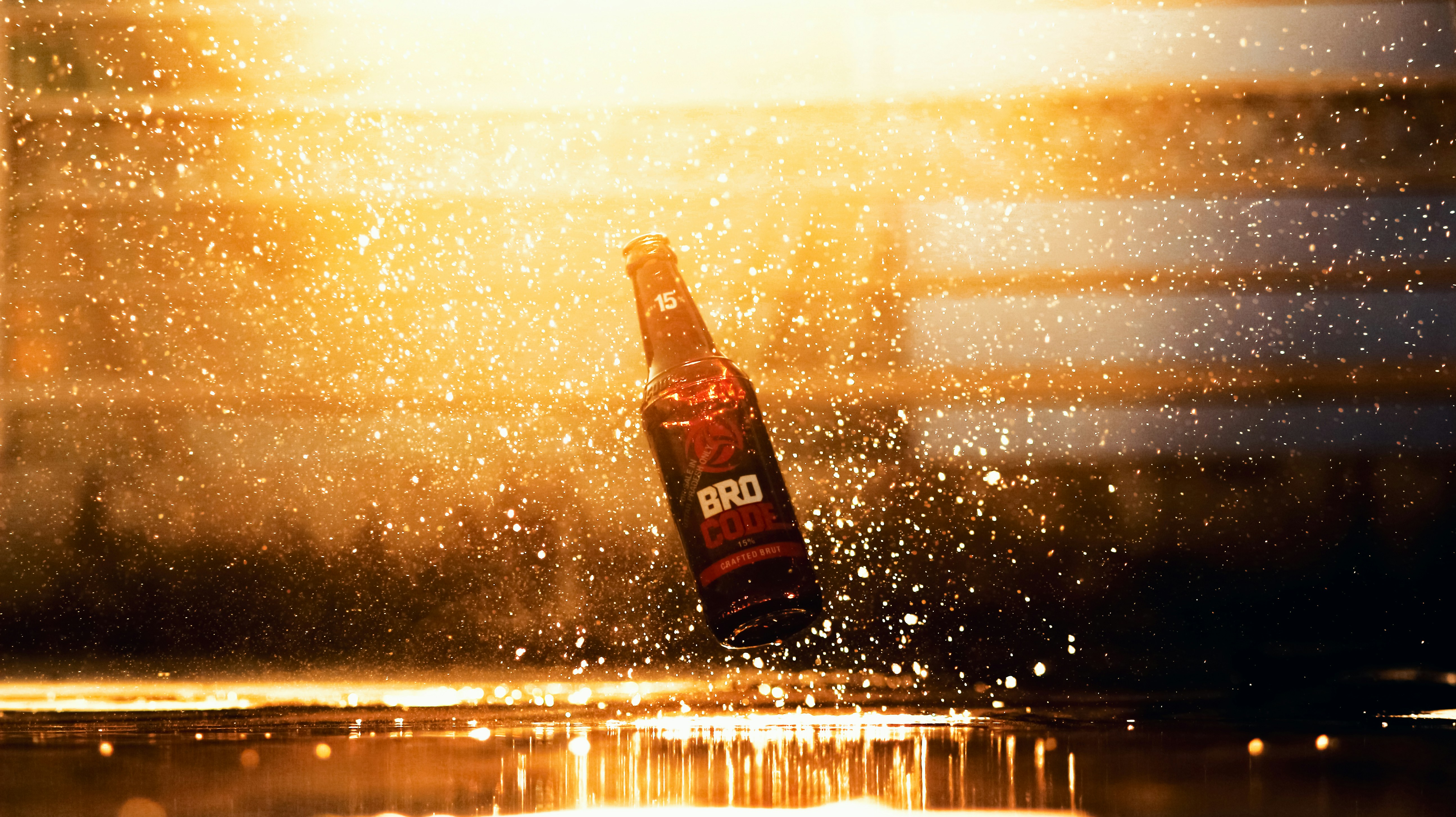 Red labeled bottle on water photo – Free Kerala Image on Unsplash