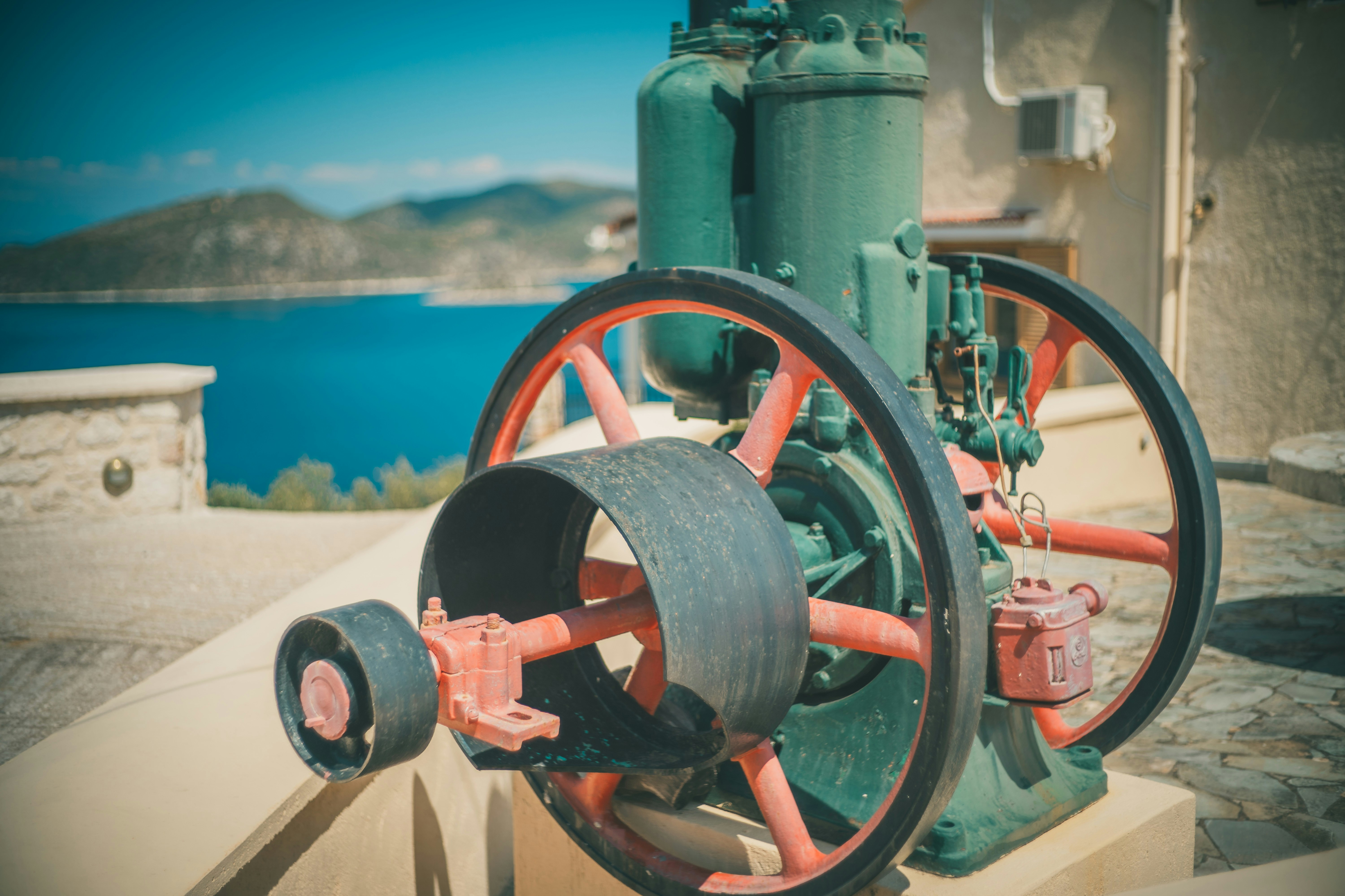 Opposing Wheels of a Vintage Mechanism by the Sea