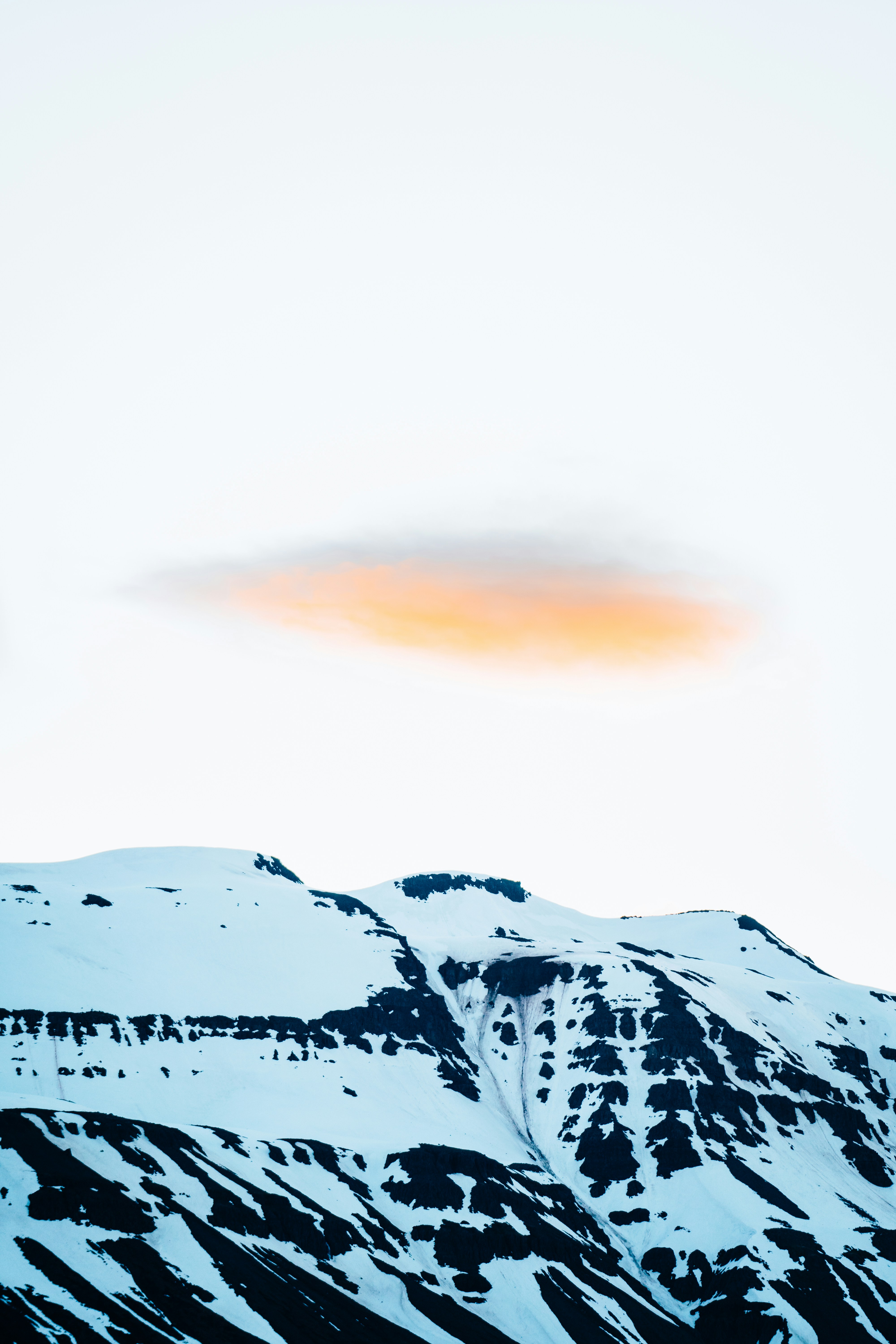Ember Cloud Over Snowbound Ridges