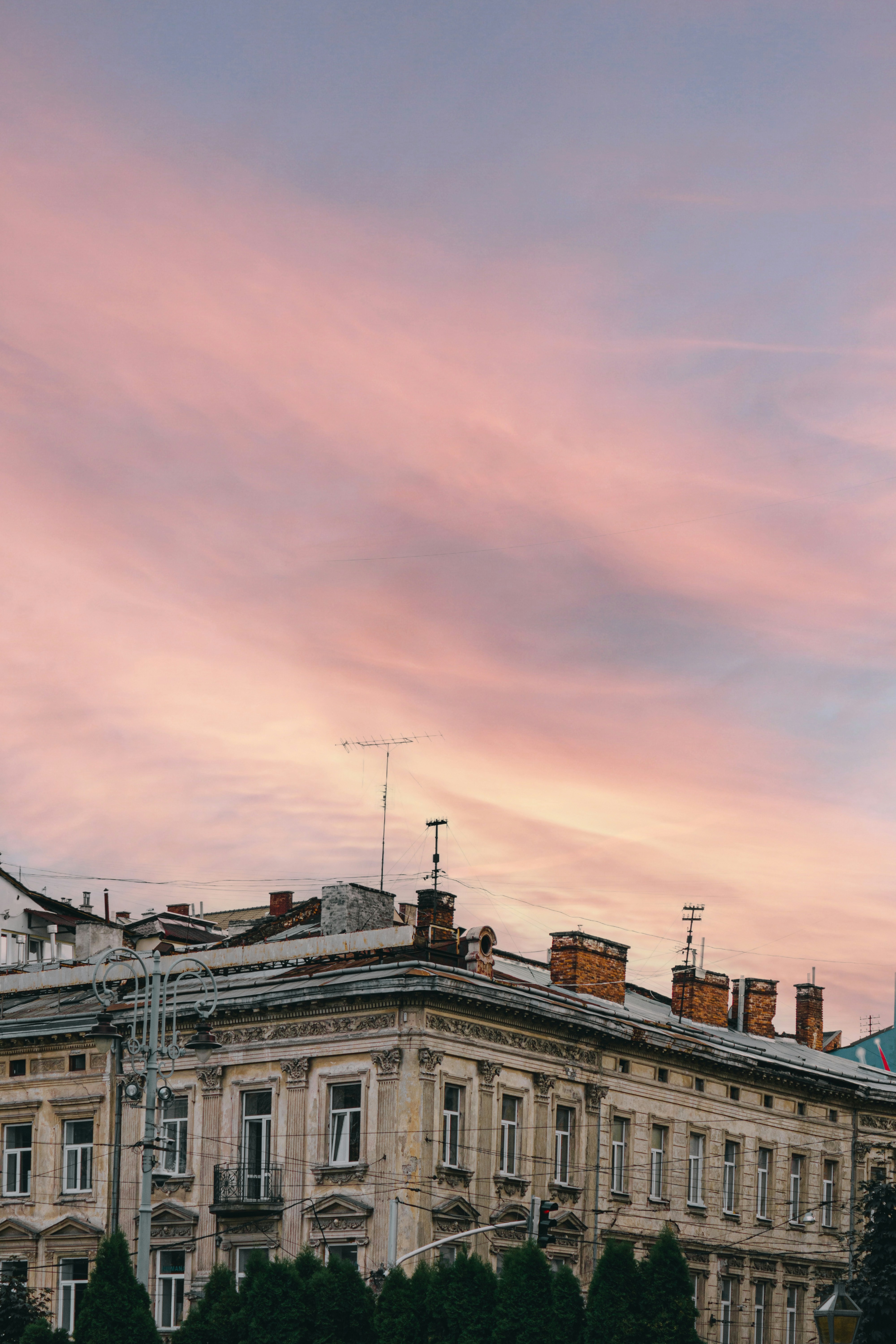 Lilac Sunset Over a Neoclassical City Roofline