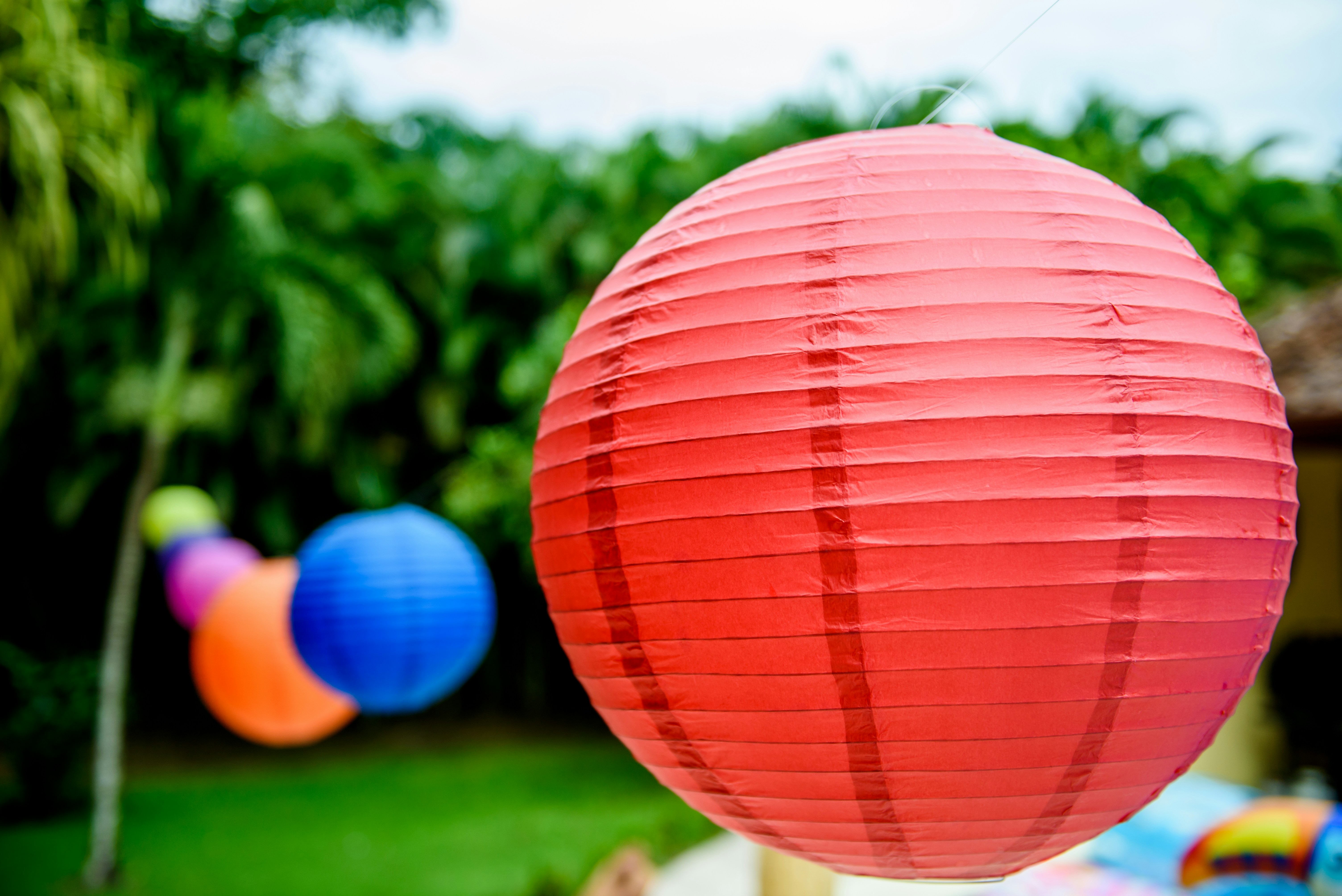 Red ball on green grass during daytime photo – Free Party decor Image ...