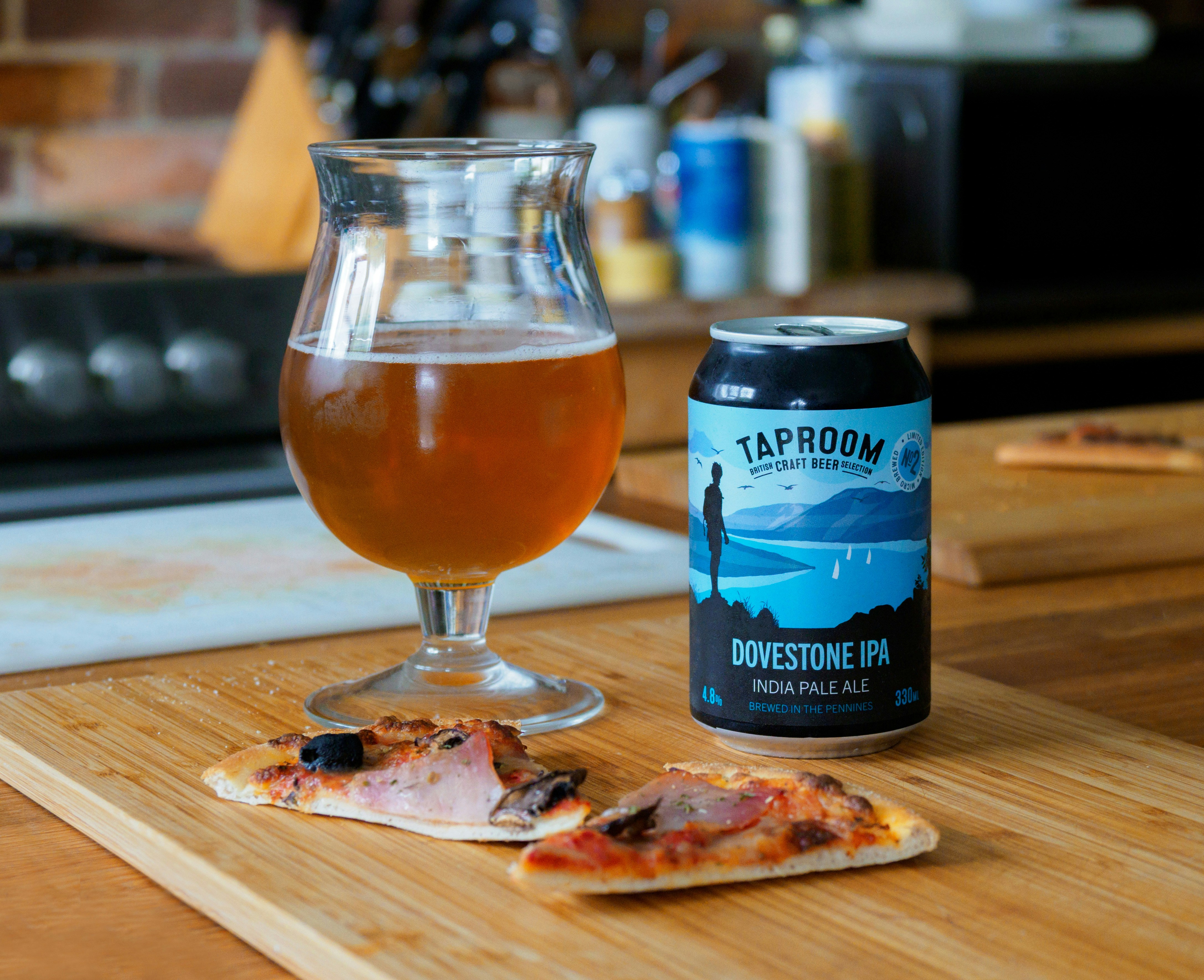 Glass, Can, and Pizza: A Craft Beer Moment on a Wooden Board