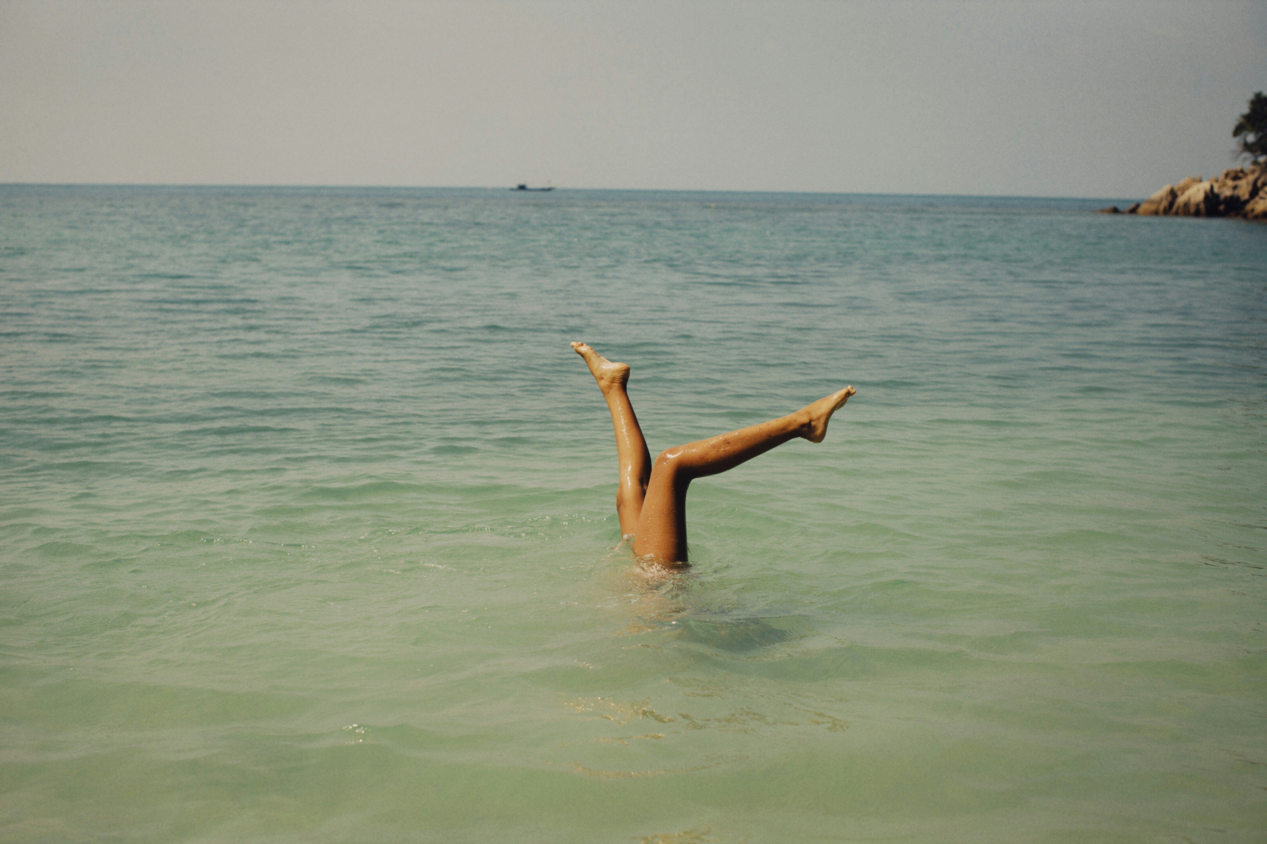 woman in body of water during daytime