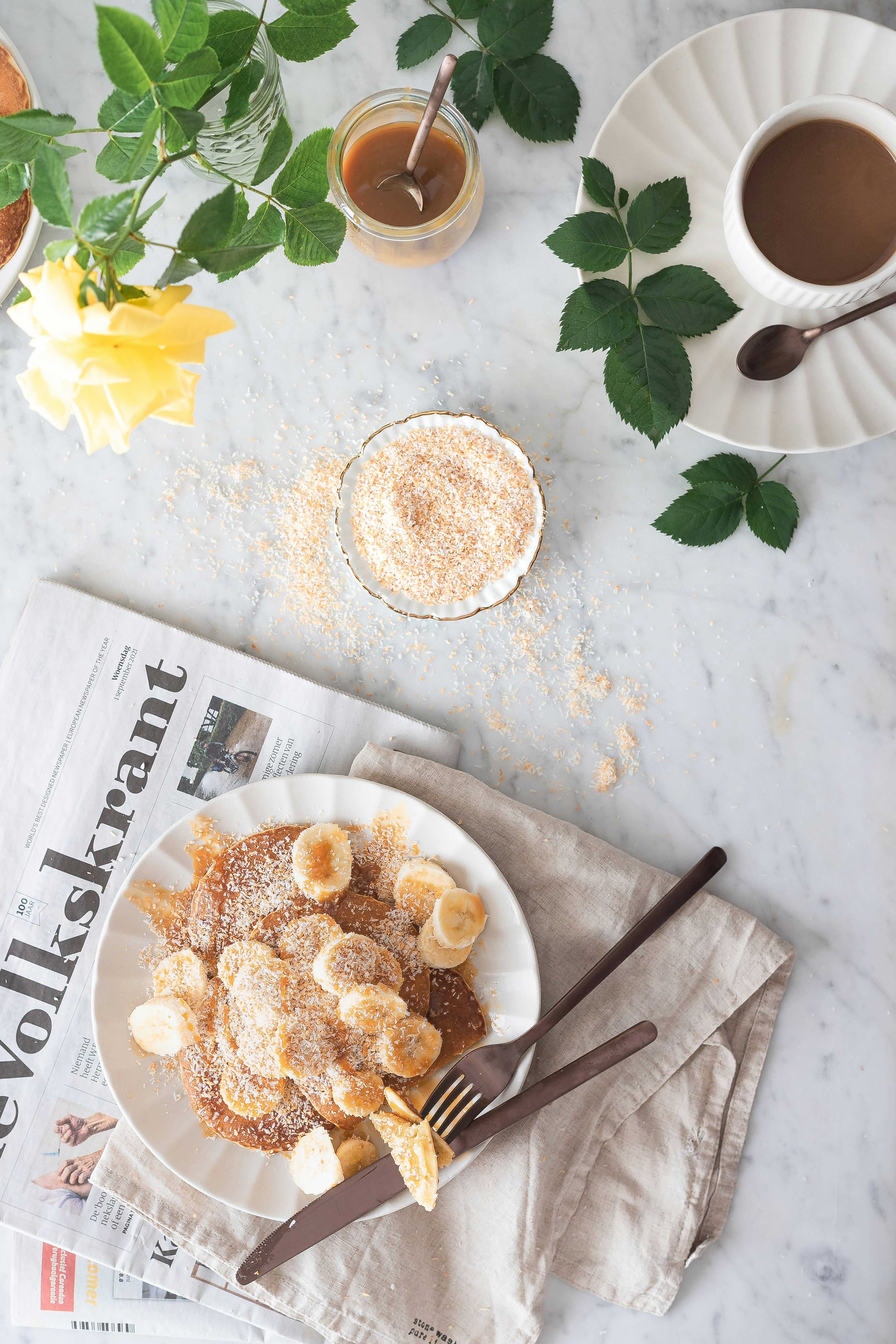 Powdered Pastries on Marble: A Quiet Morning Flat-Lay with Coffee, Honey, and Rose