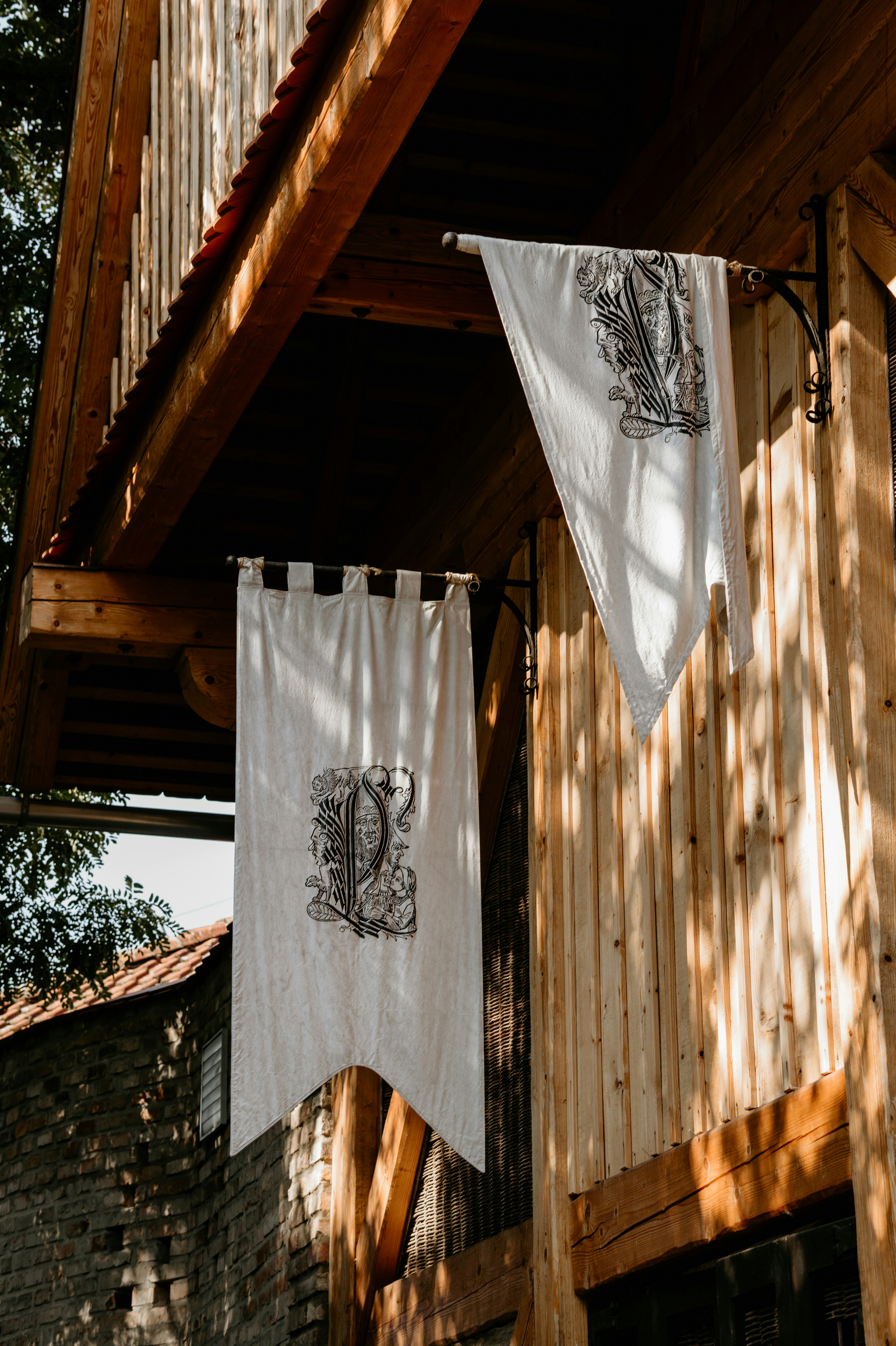 Heraldic Banners in a Sunlit Timber Veranda