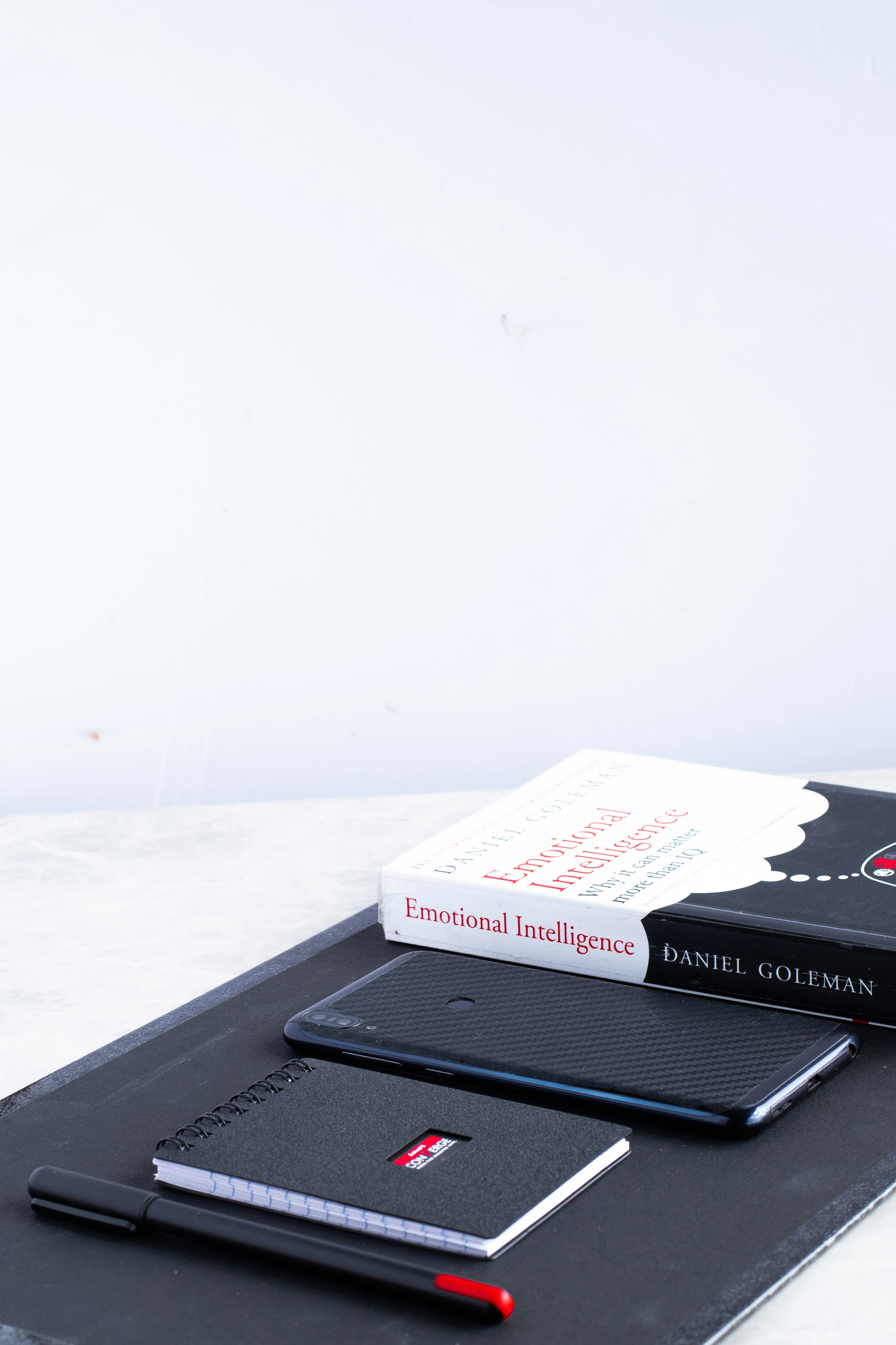 Goleman on the Desk: A Quiet Study Scene with Books and Tech