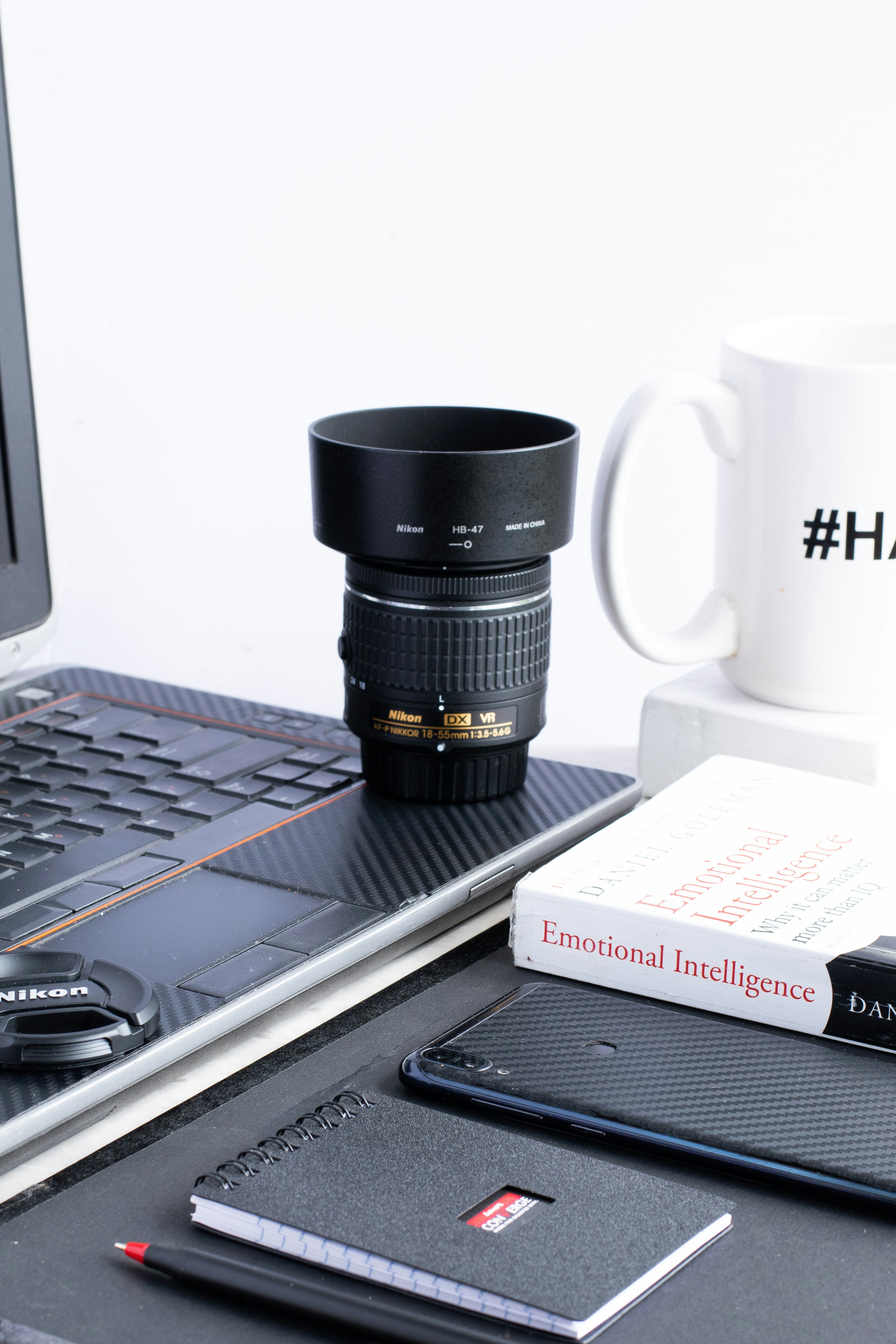 Nikon Lens on a Laptop: A Quiet Desk Studio