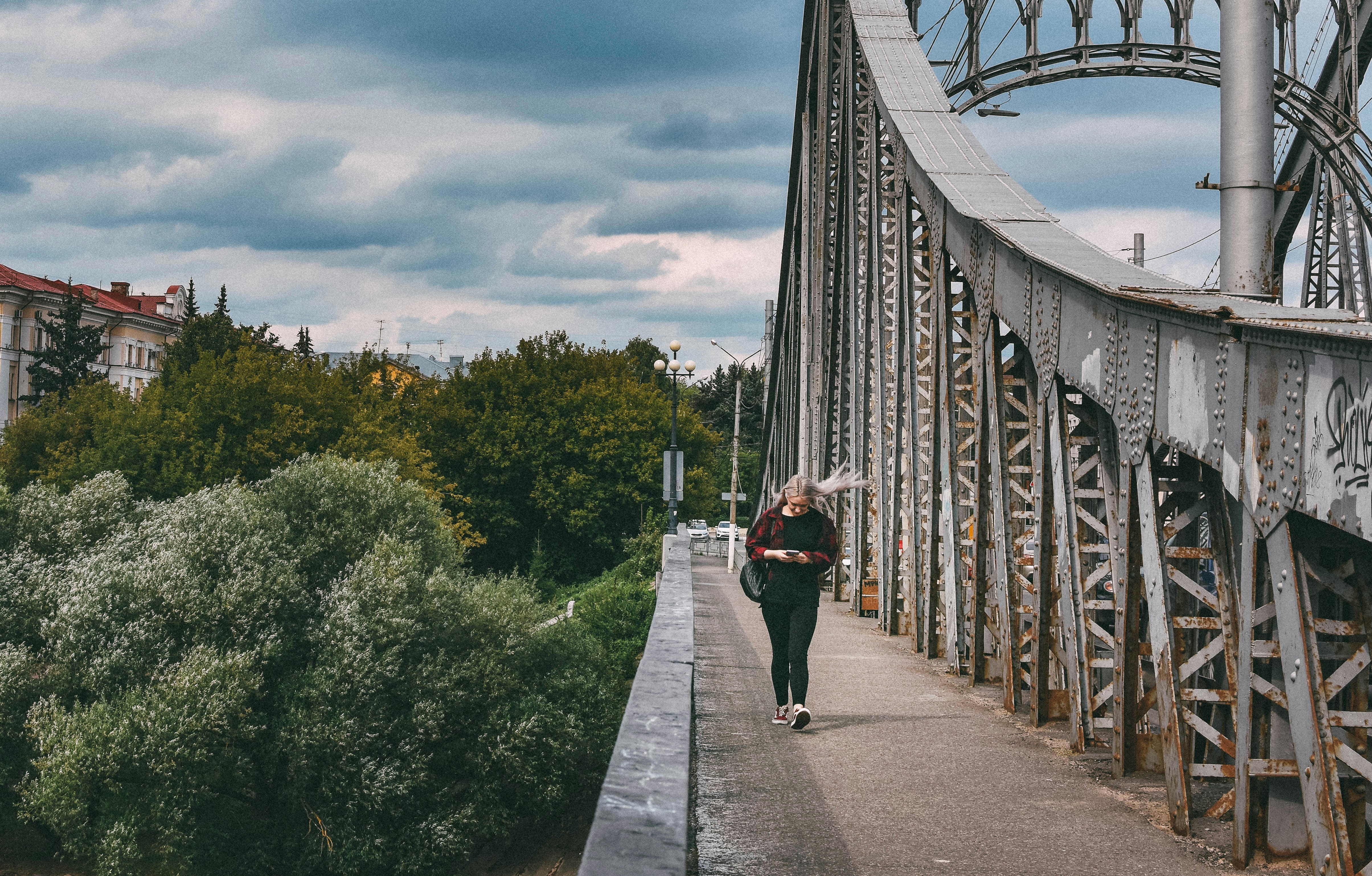 People walking on gray concrete bridge during daytime photo – Free ...