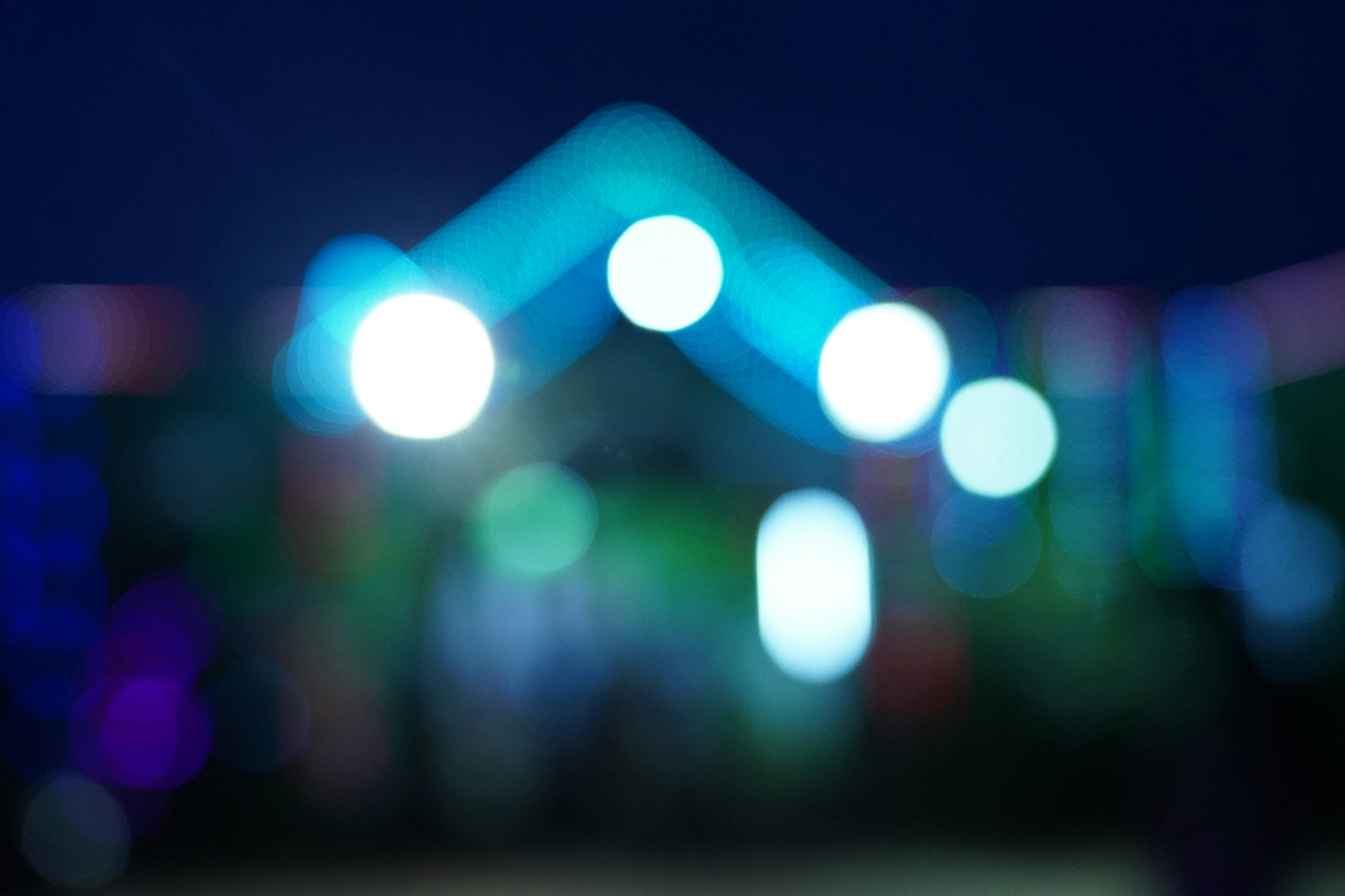 Neon Blur: A Night of Vivid Bokeh at the Expo Gate
