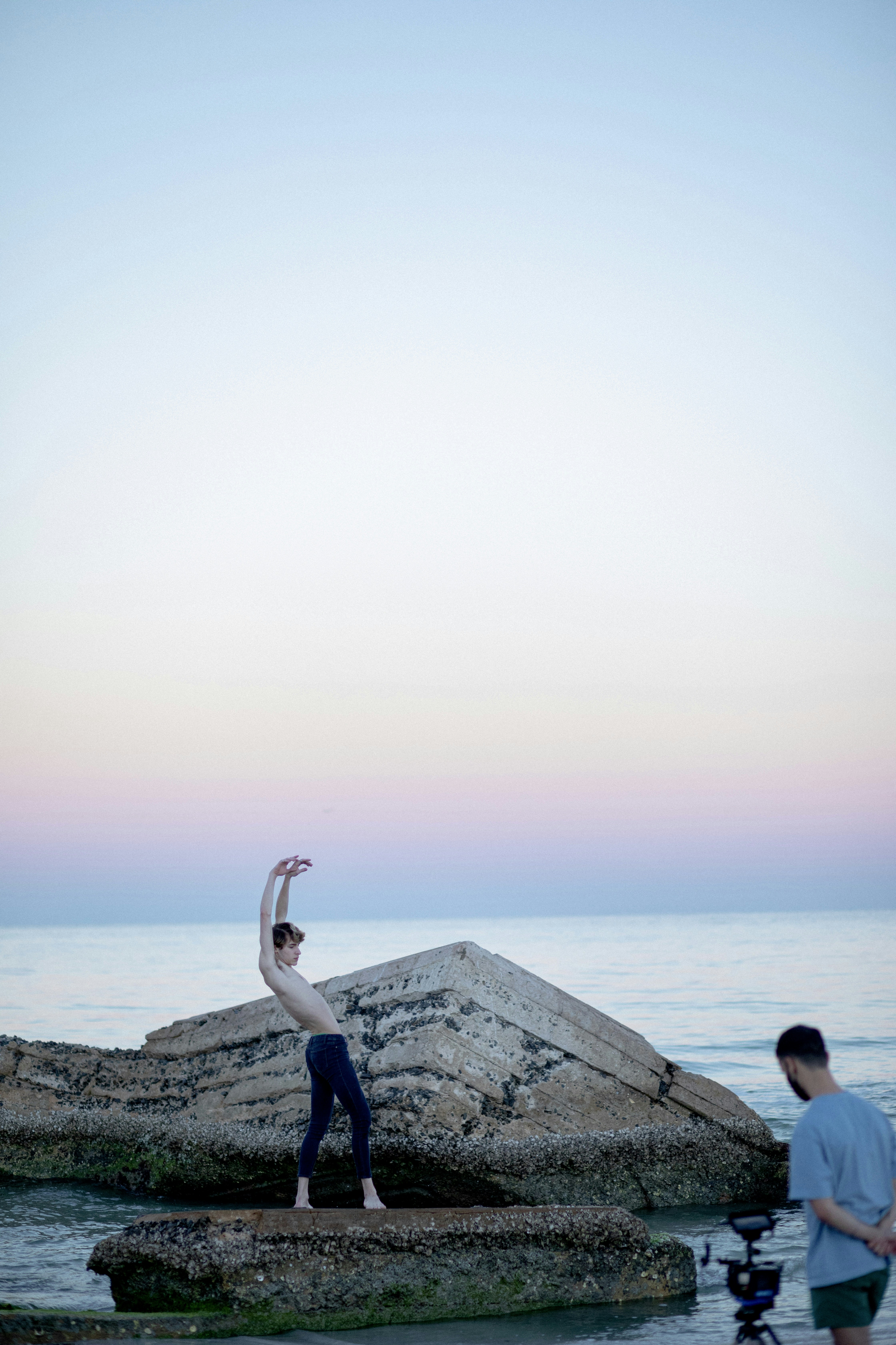 Twilight Arc on the Breakwater: Dancer at Dusk