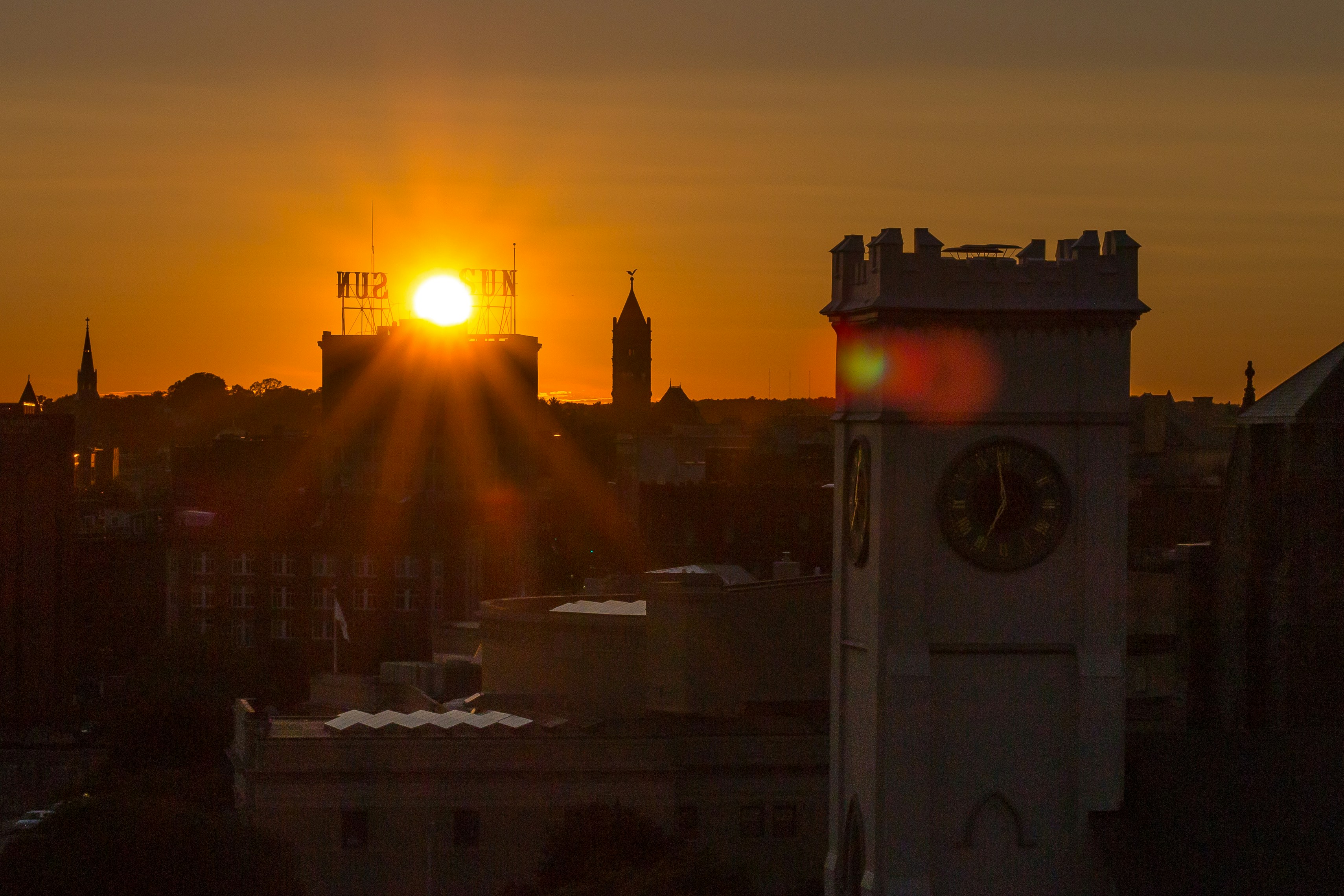 Dusk Sunburst Over the Clock Tower Skyline