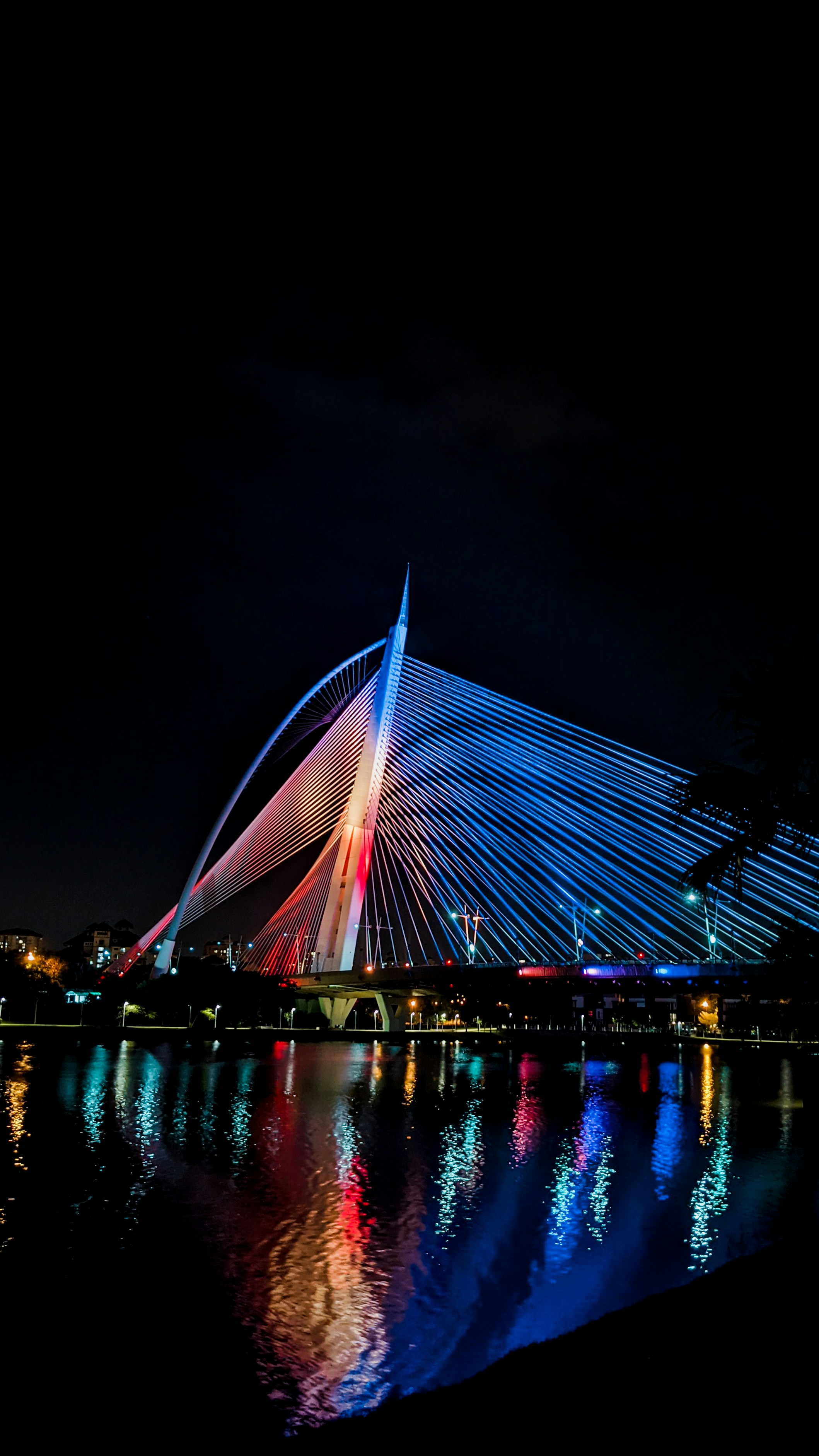 A night view by the lake of the Jambatan Wawasan located in Putrajaya.