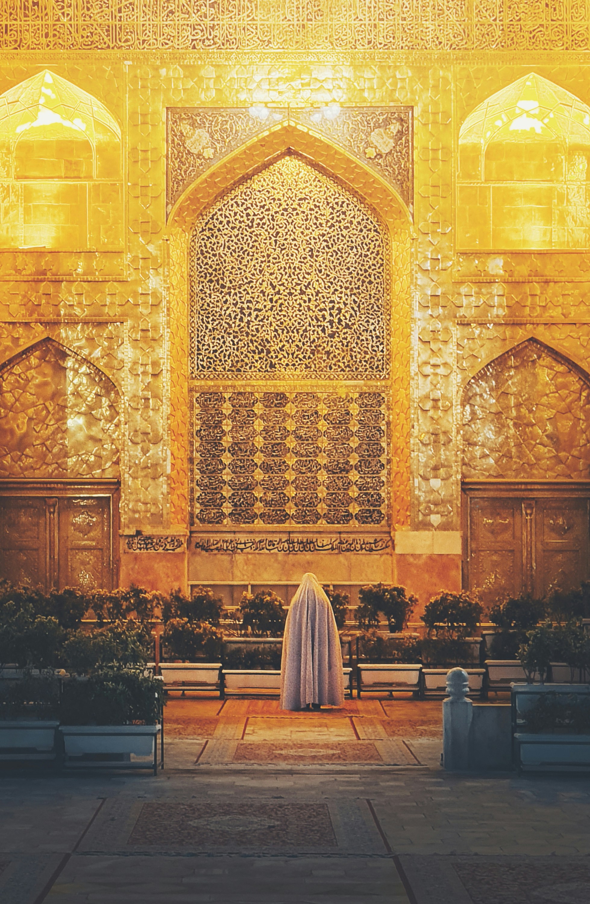 Gilded Portal Silence: A Veiled Figure Before Encased Light