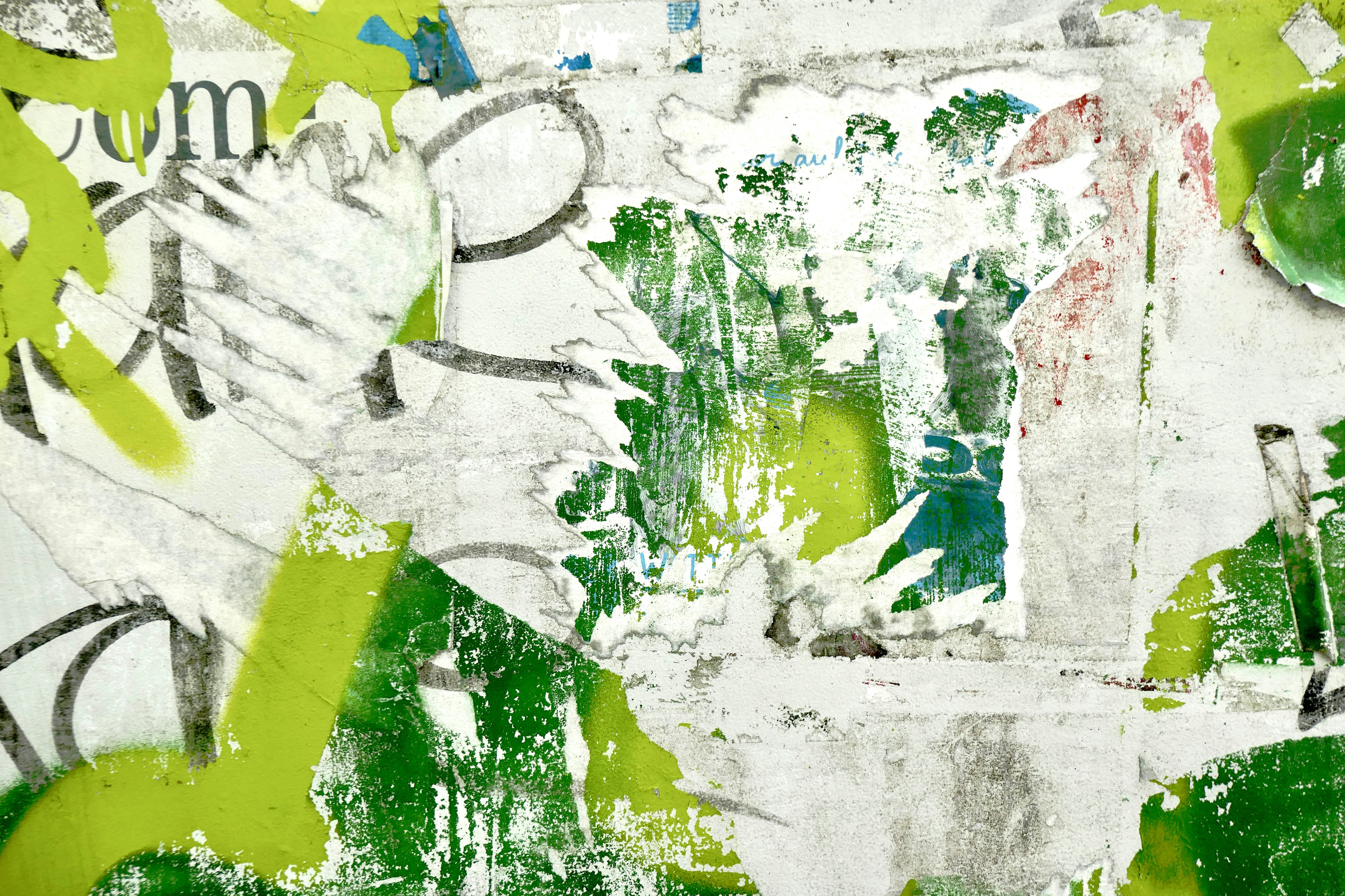 Vibrant Green Tangle: Abstract Graffiti on a Weathered Wall