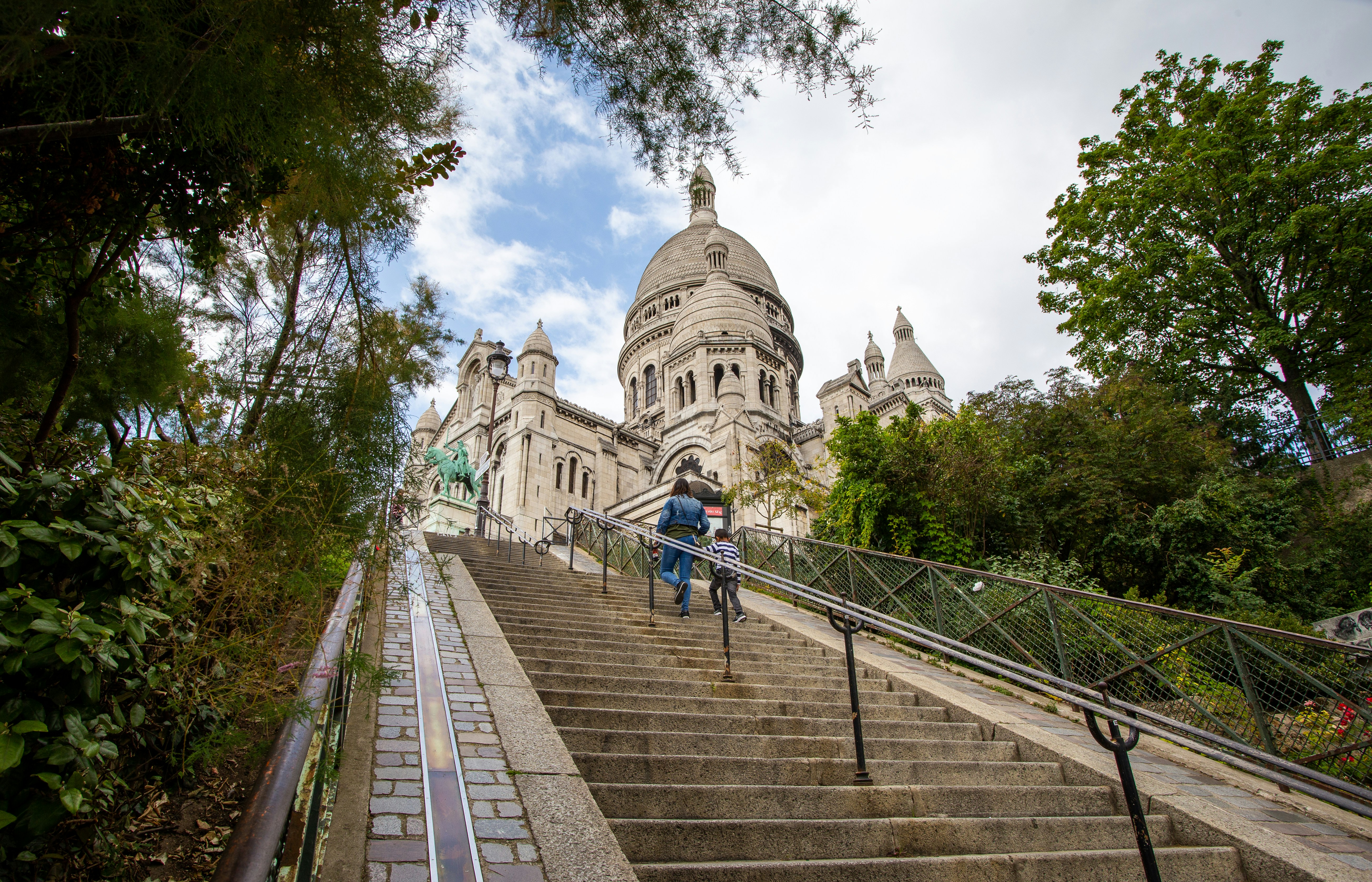 Ascending to the Basilica: A Journey Through Verdant StepsAndrea García
