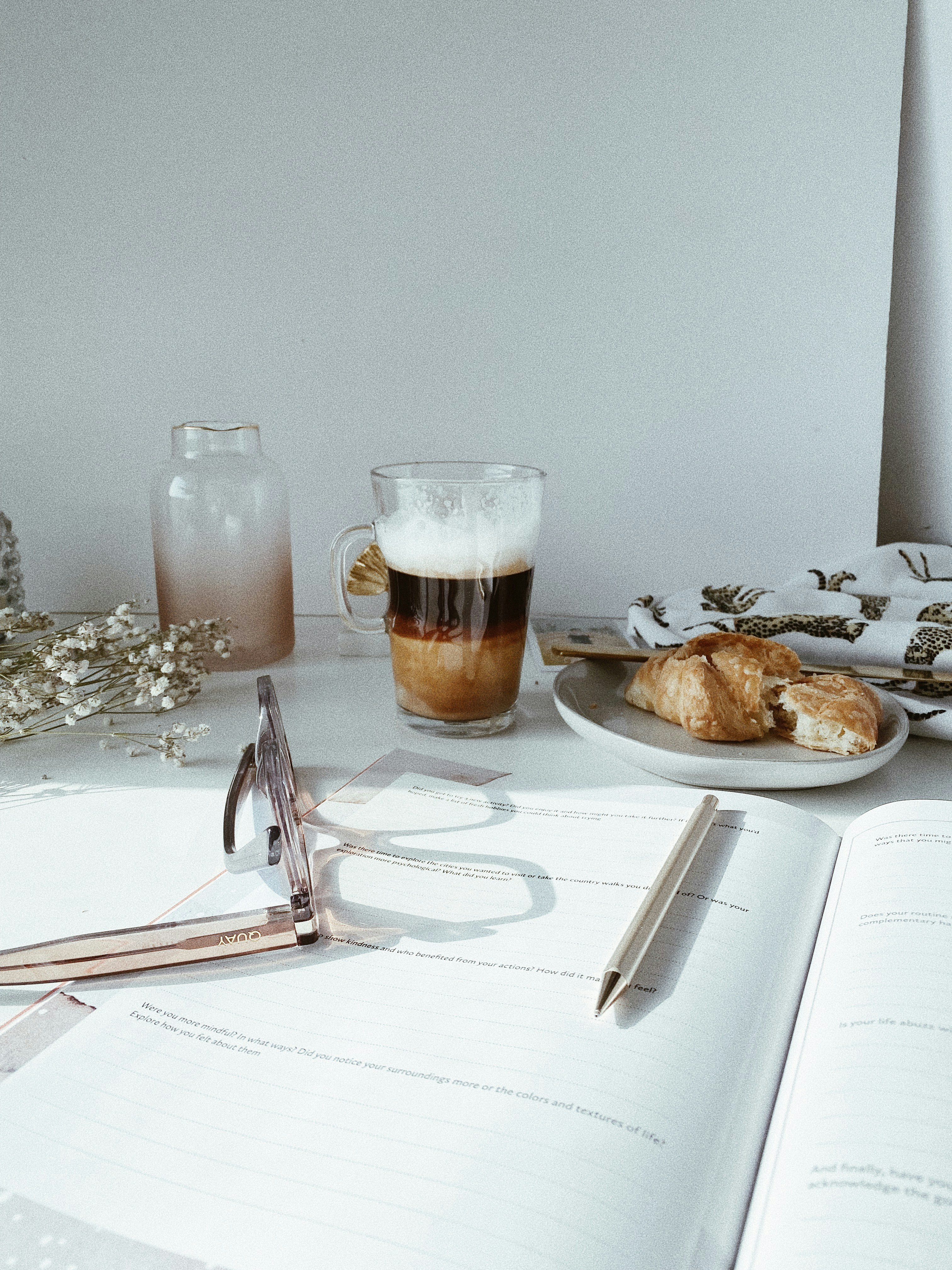 Steam and Ink: Morning Desk with Coffee, Pastry, and Open Book