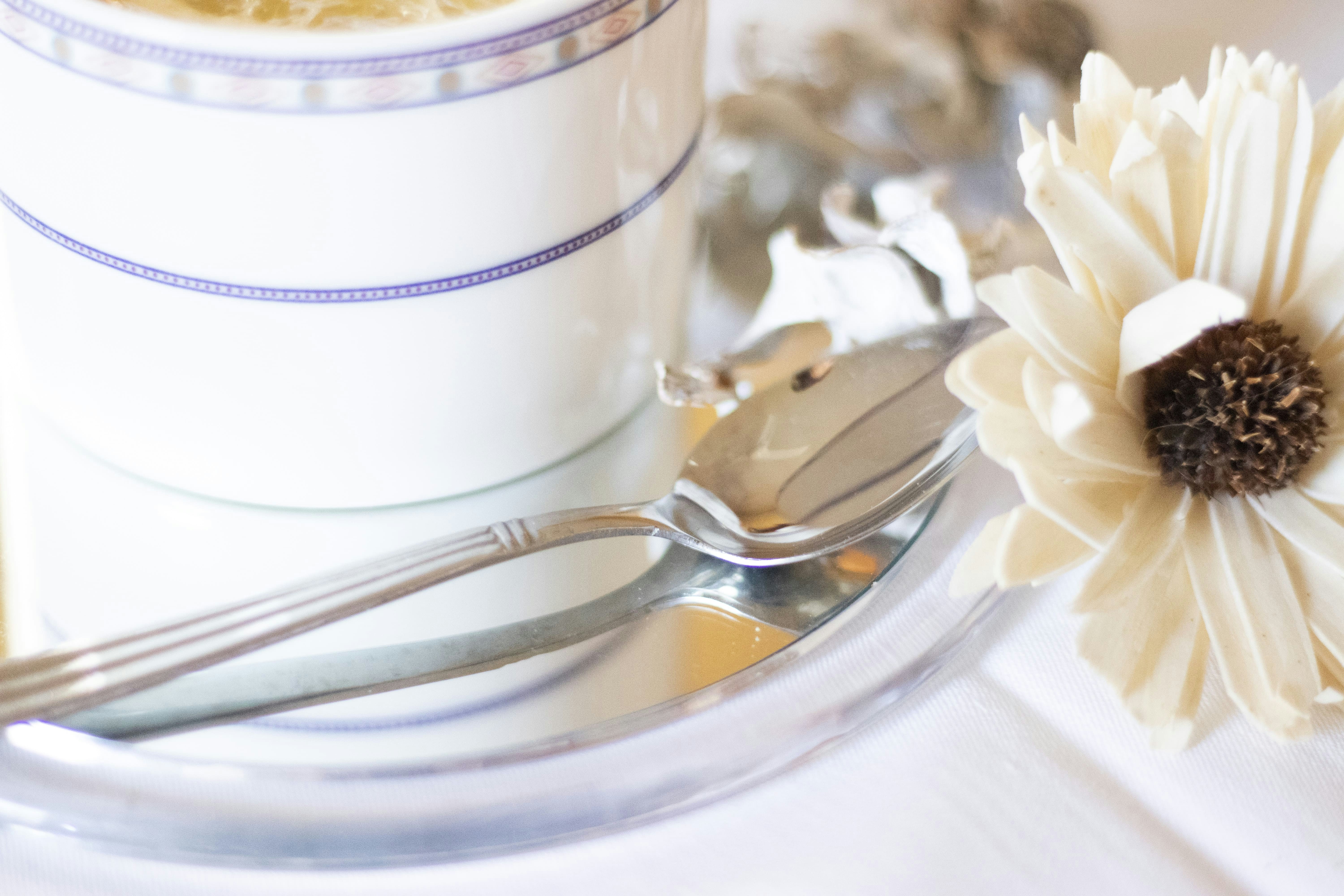 Stainless steel spoon beside white ceramic mug photo – Free Cutlery ...