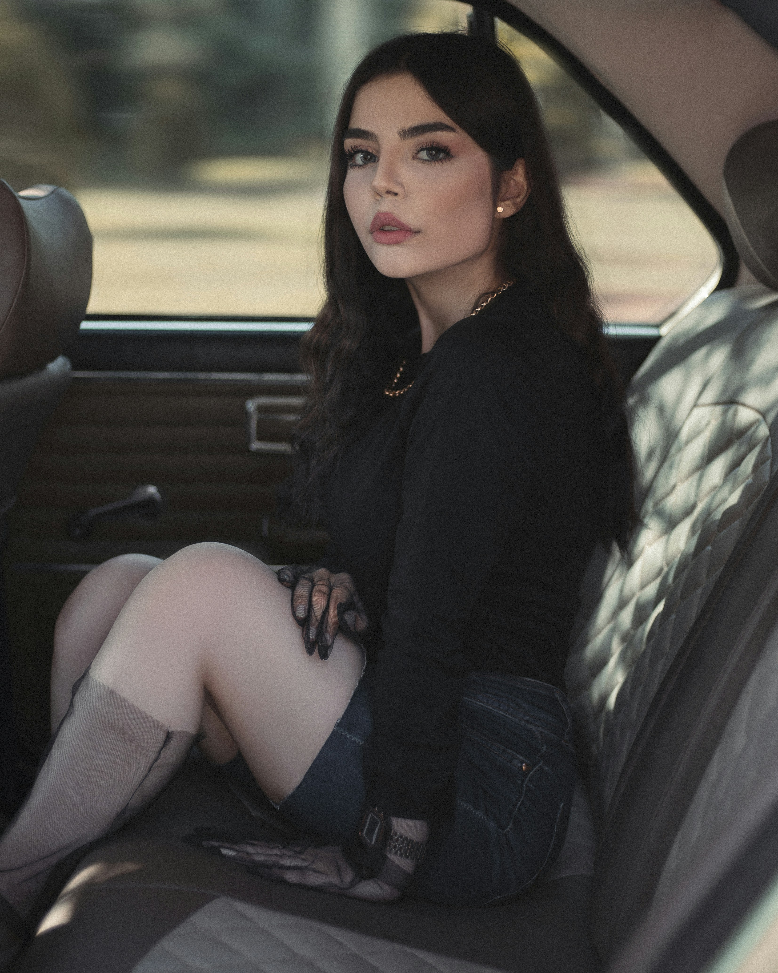 Backseat Gaze: Quiet Confidence in a Vintage Car Interior