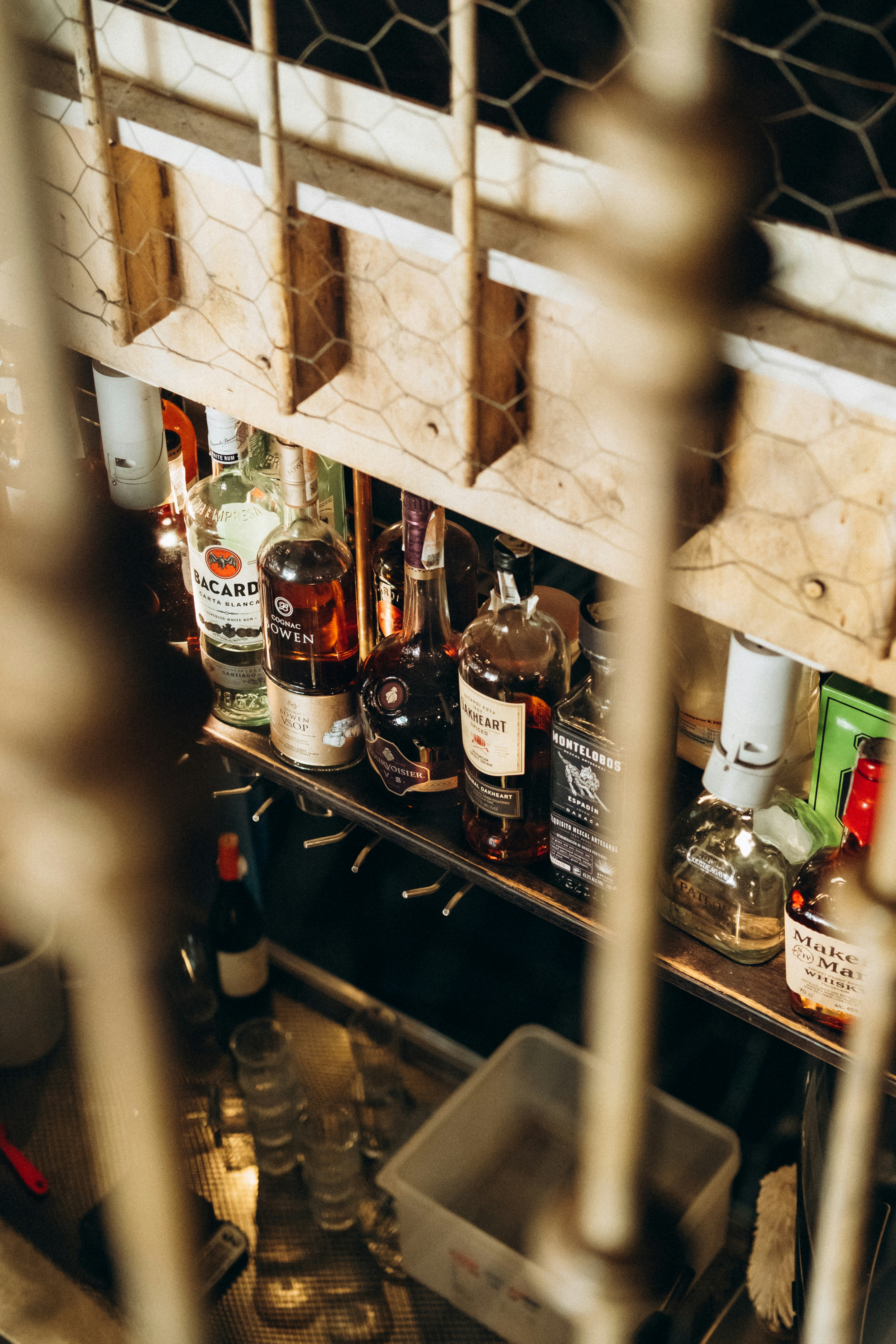 bottles on glass shelf in room