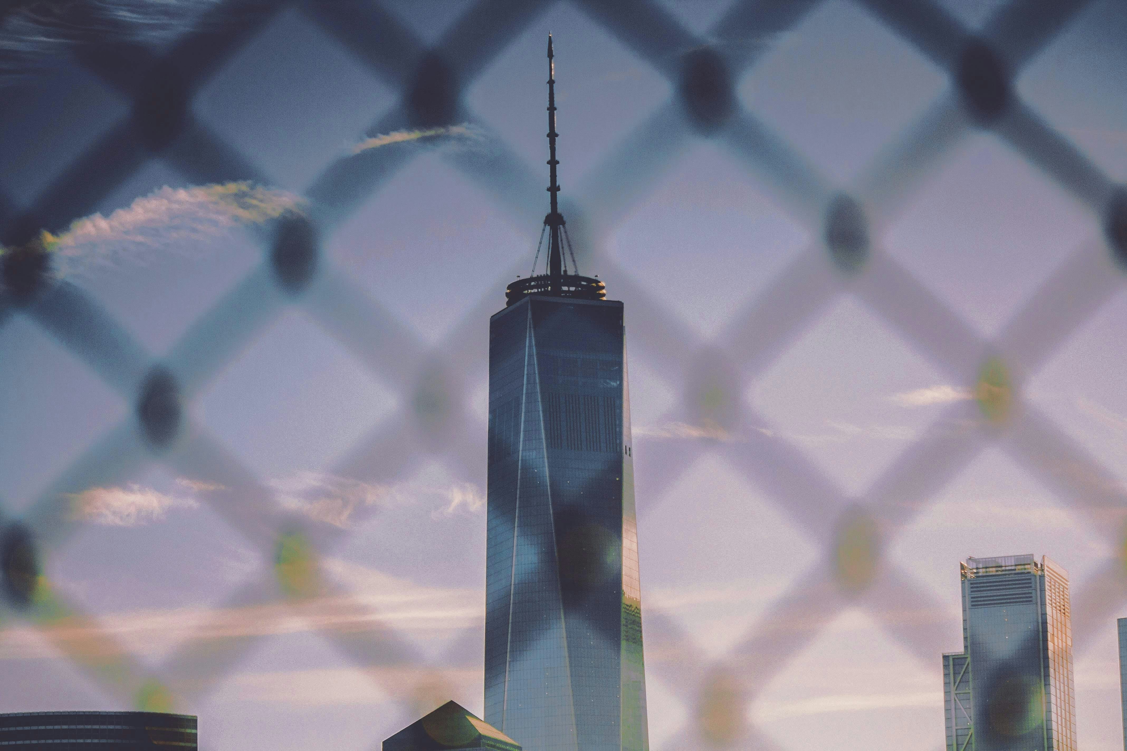 Through a Chain-Link Window: City Spire in Transit