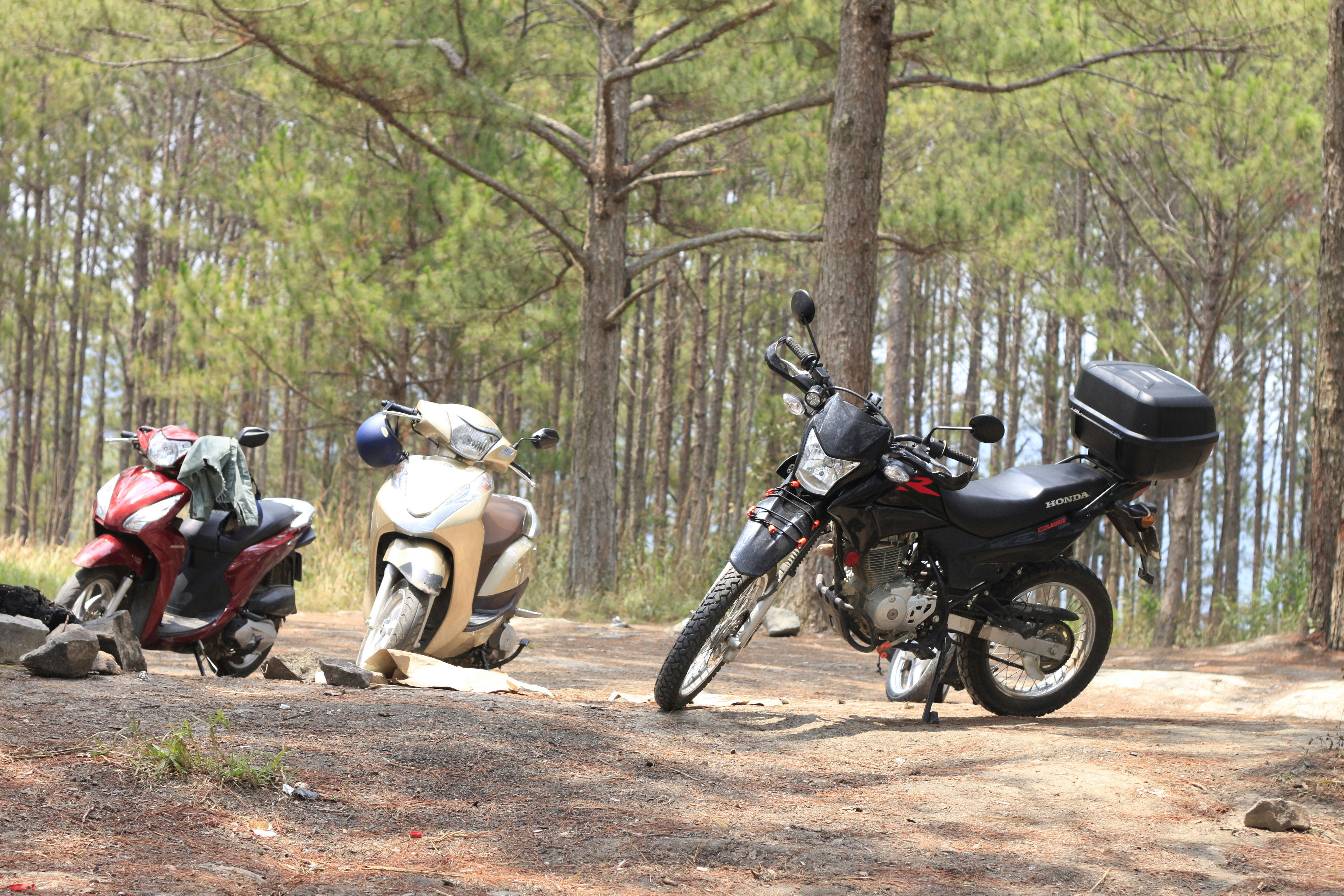 man in blue shirt and brown pants riding black motorcycle