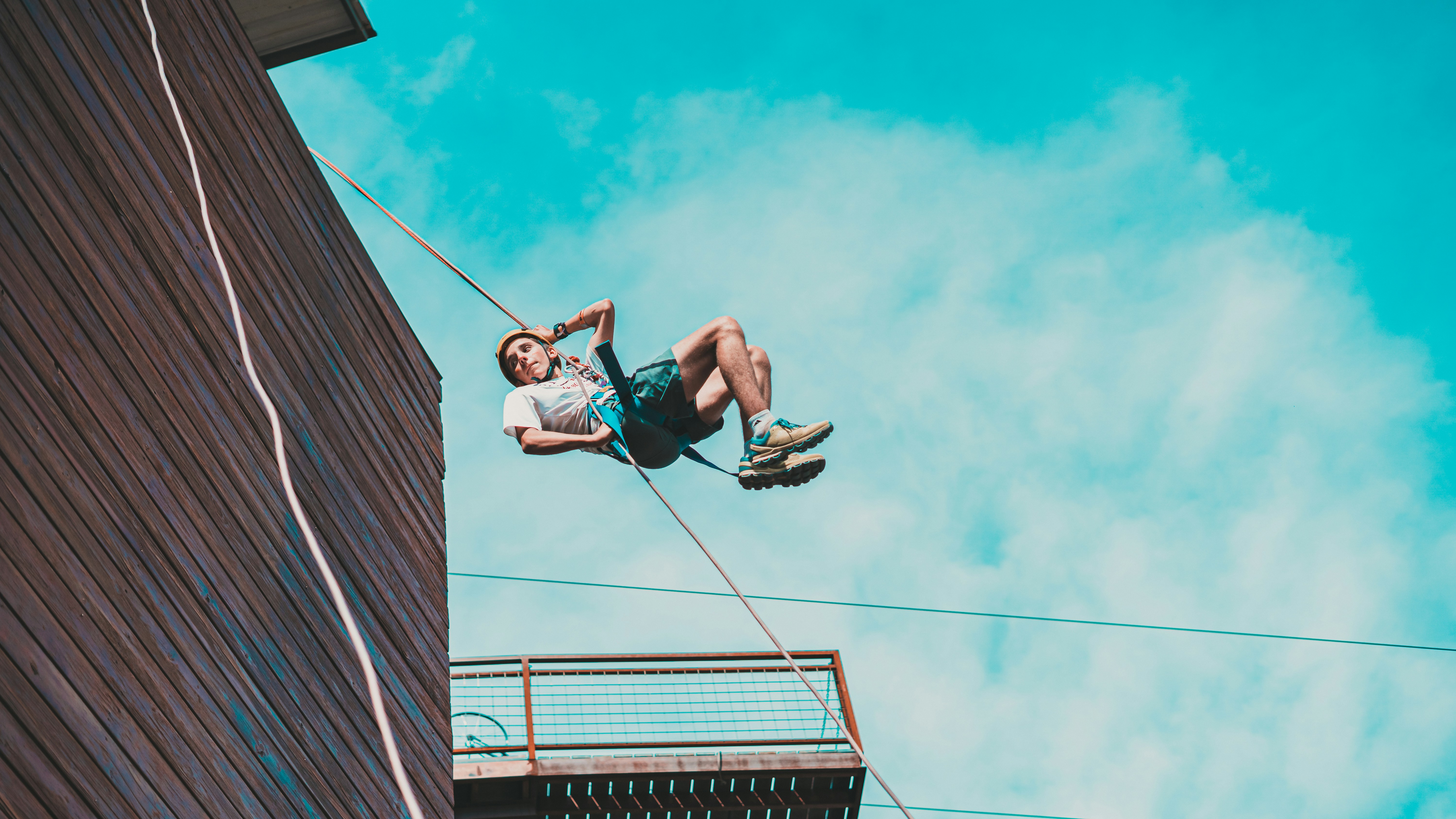 A man on a rope high up in the air photo – Free Nm Image on Unsplash