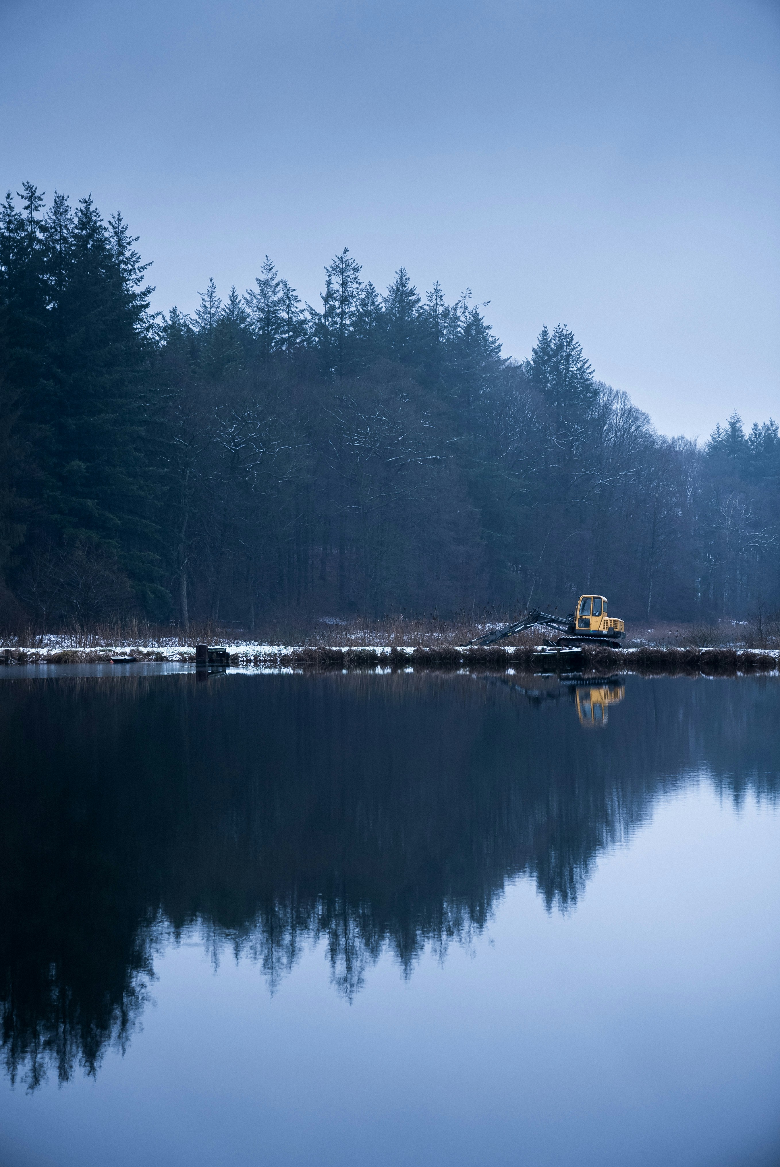 A mini excavator near a lake near Aukrug.