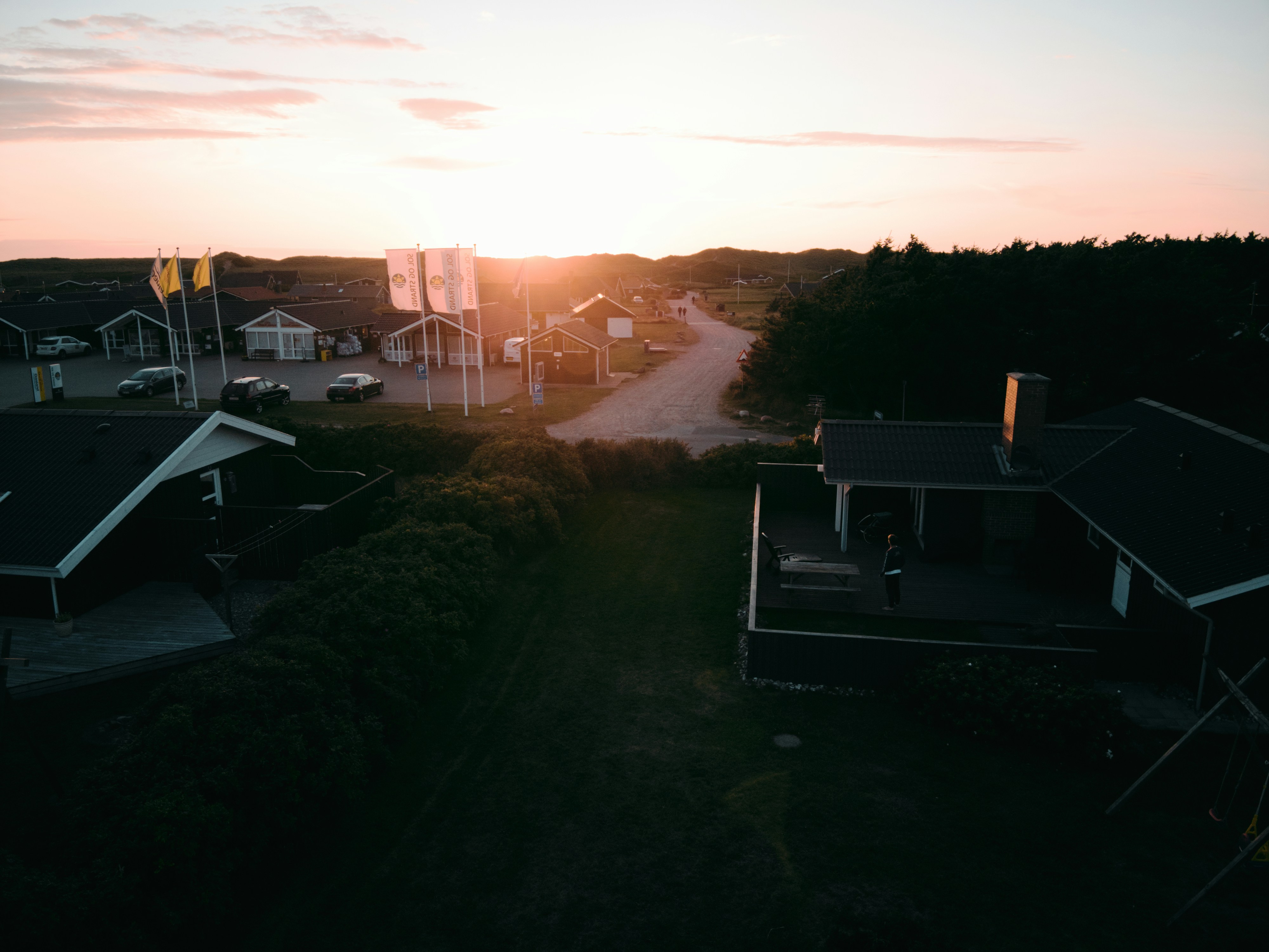 Horizon Glow Over a Quiet Suburban Row at Sunset