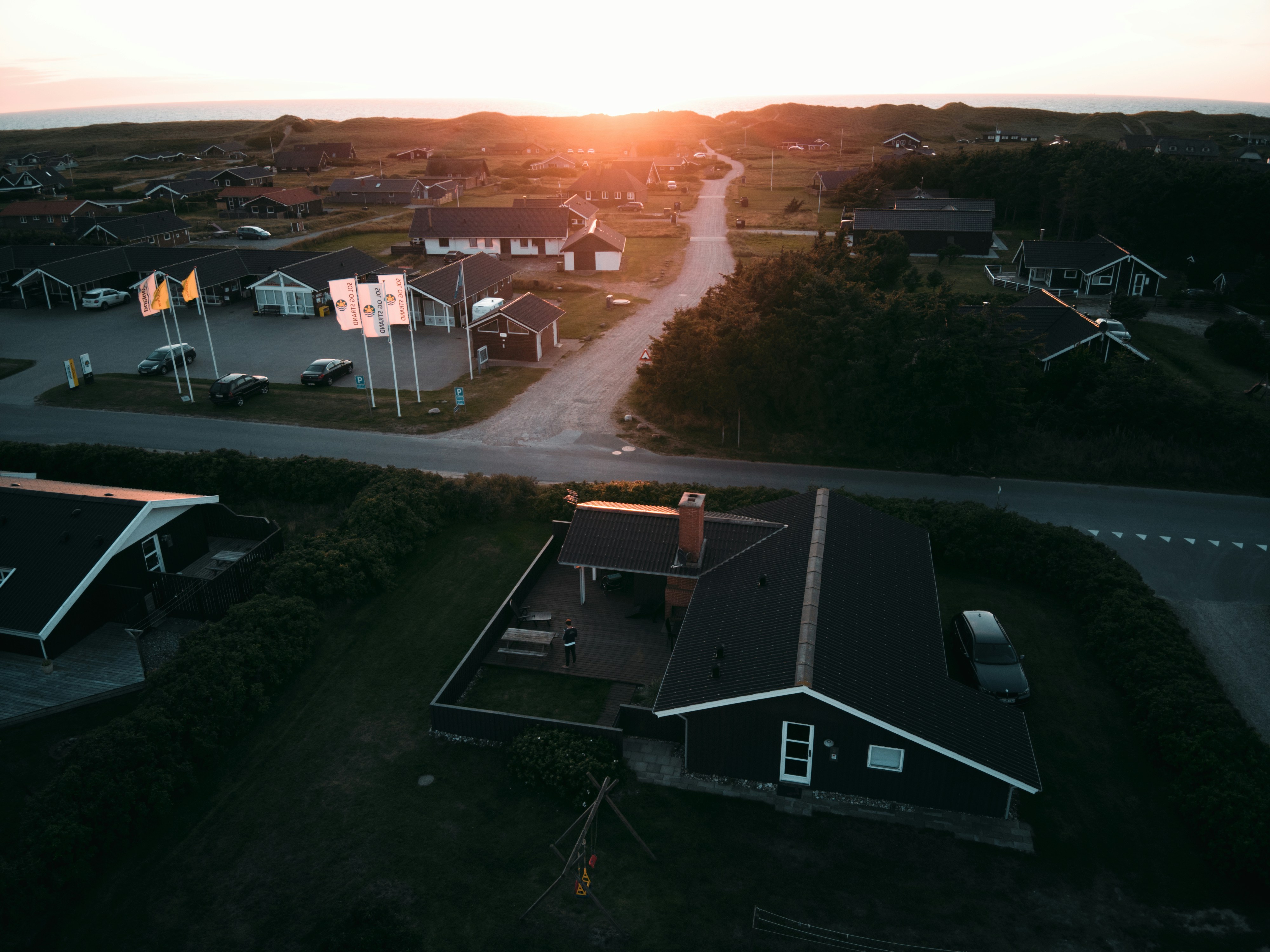 Sunset Over Quiet Suburb: A Drone’s View of Quiet Streets and Dwellings