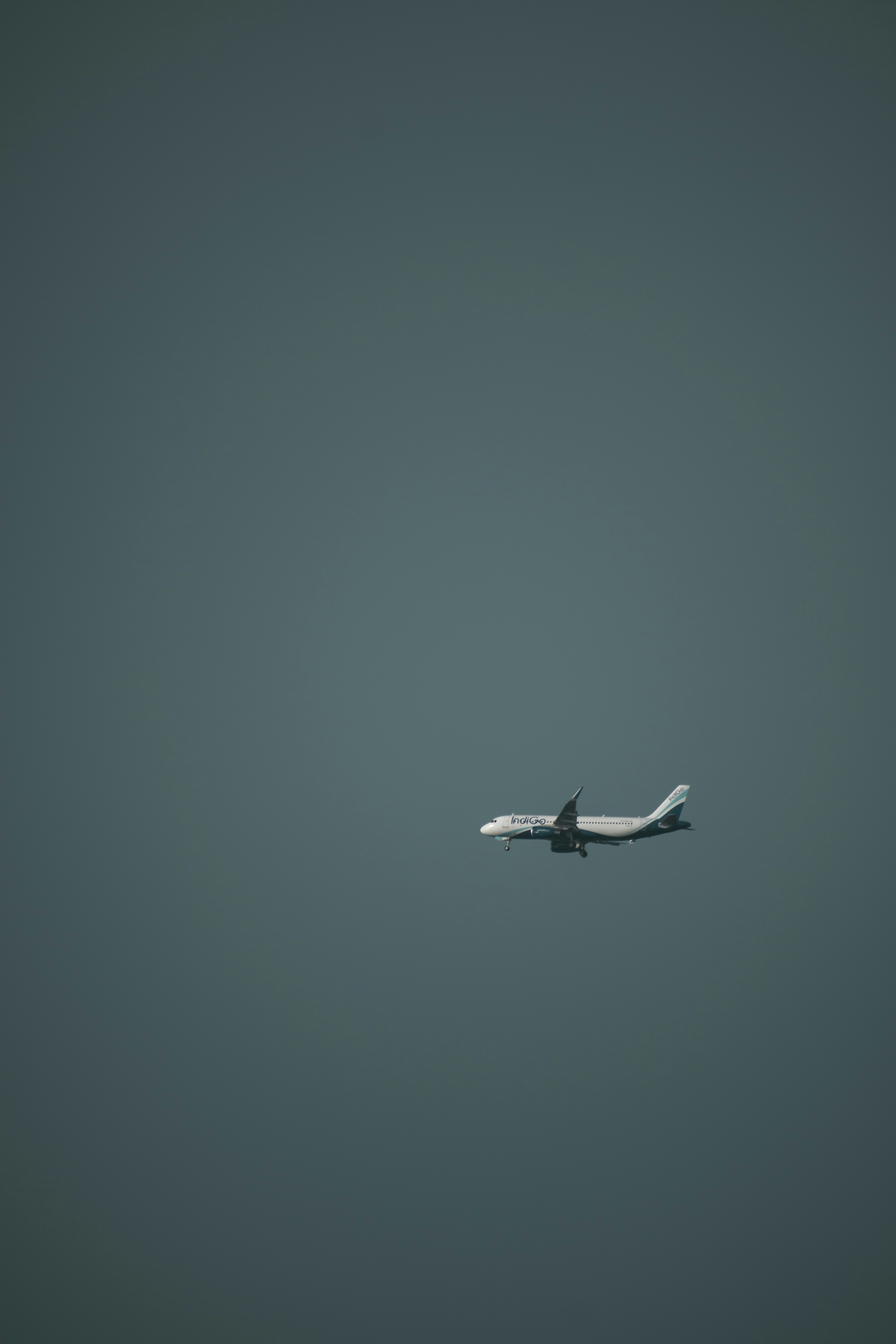 white airplane in mid air