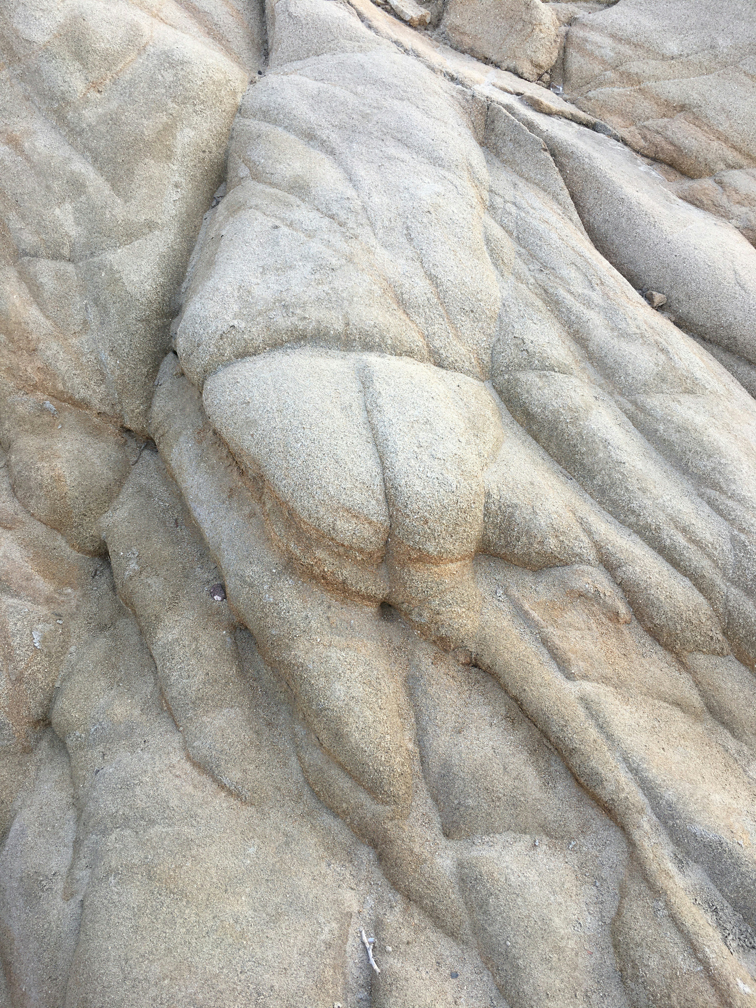 brown and white textile on brown sand