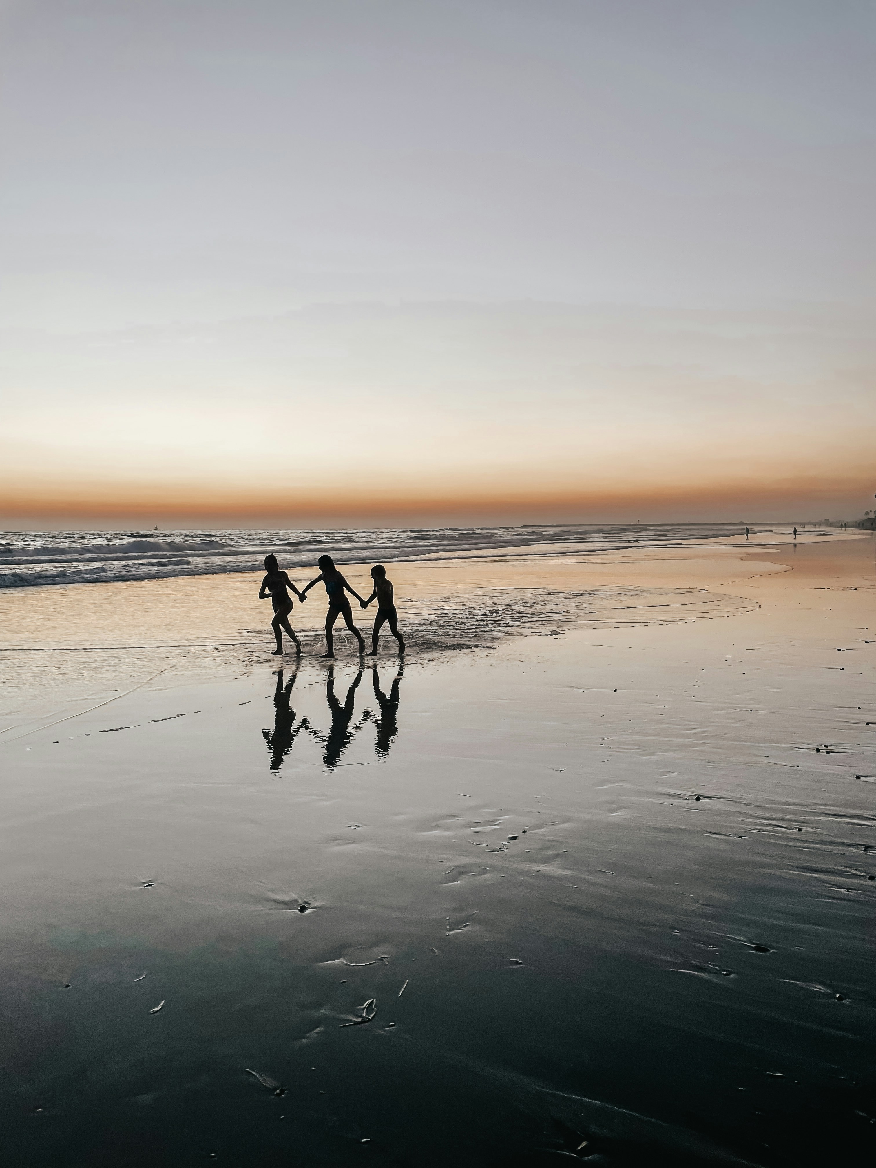 2 people walking on beach during sunset photo – Free Beach Image on ...