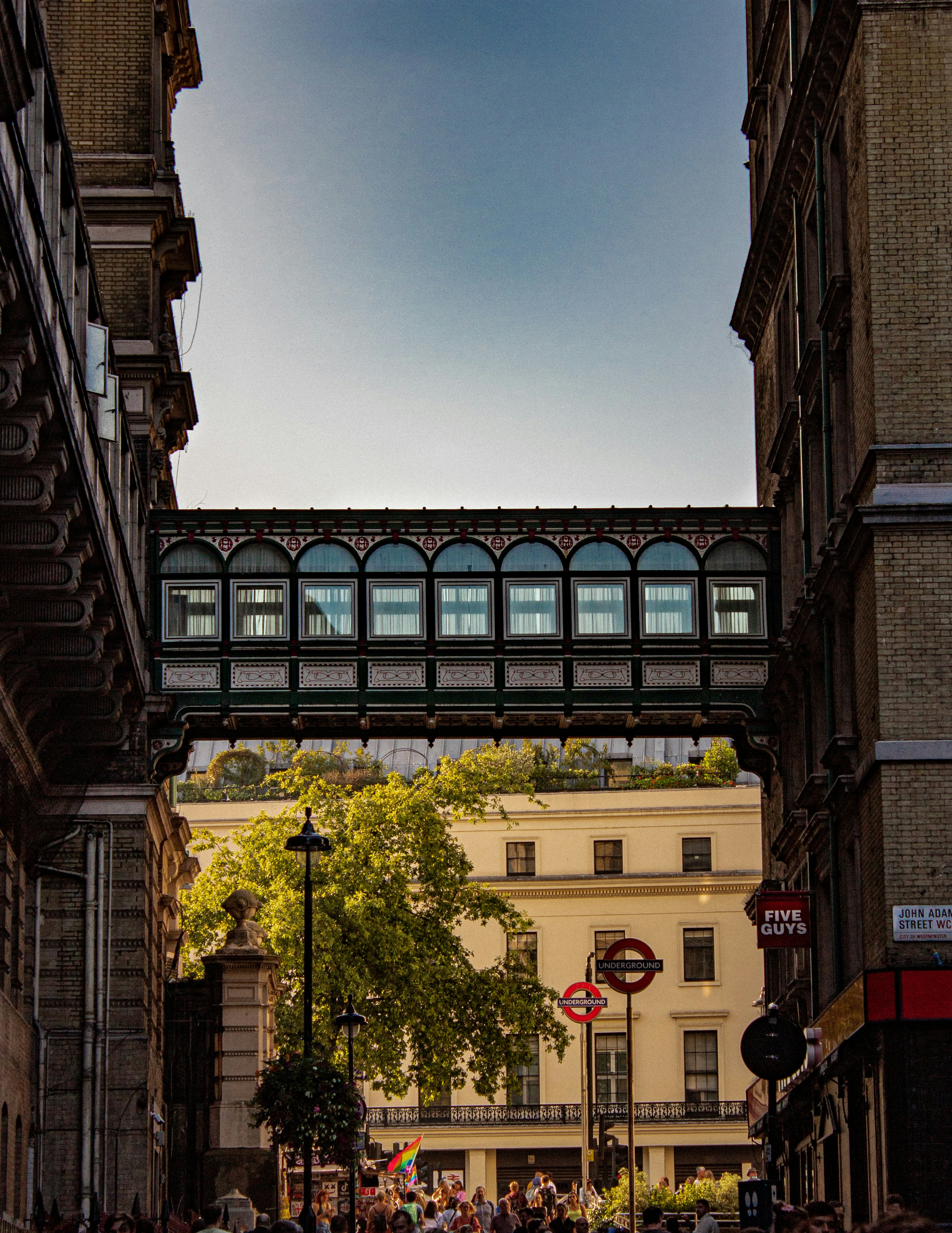 Arched Glass Skyway Framing a Busy City Street