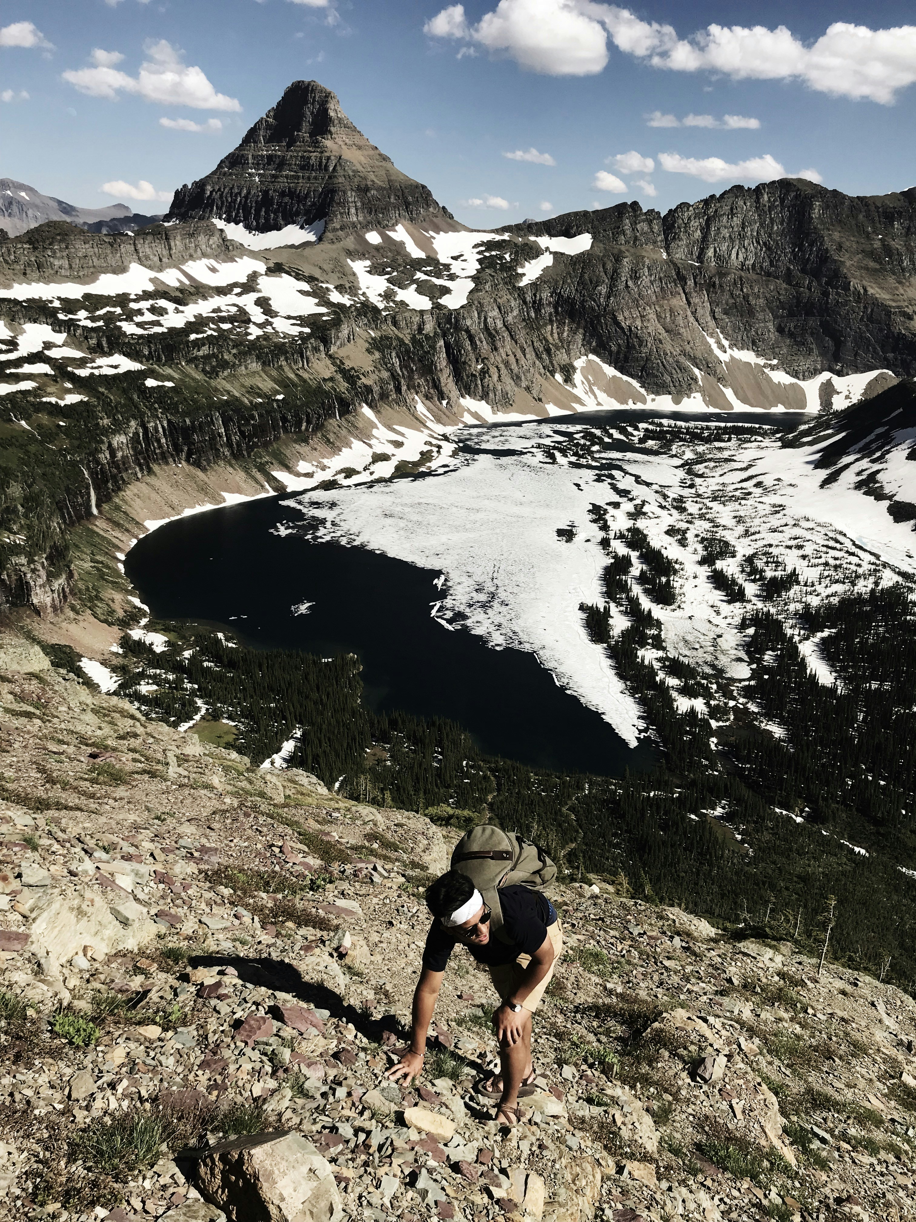 Ridge Climber: A Solo Ascent Above a Snow-Dusted Alpine Lake
