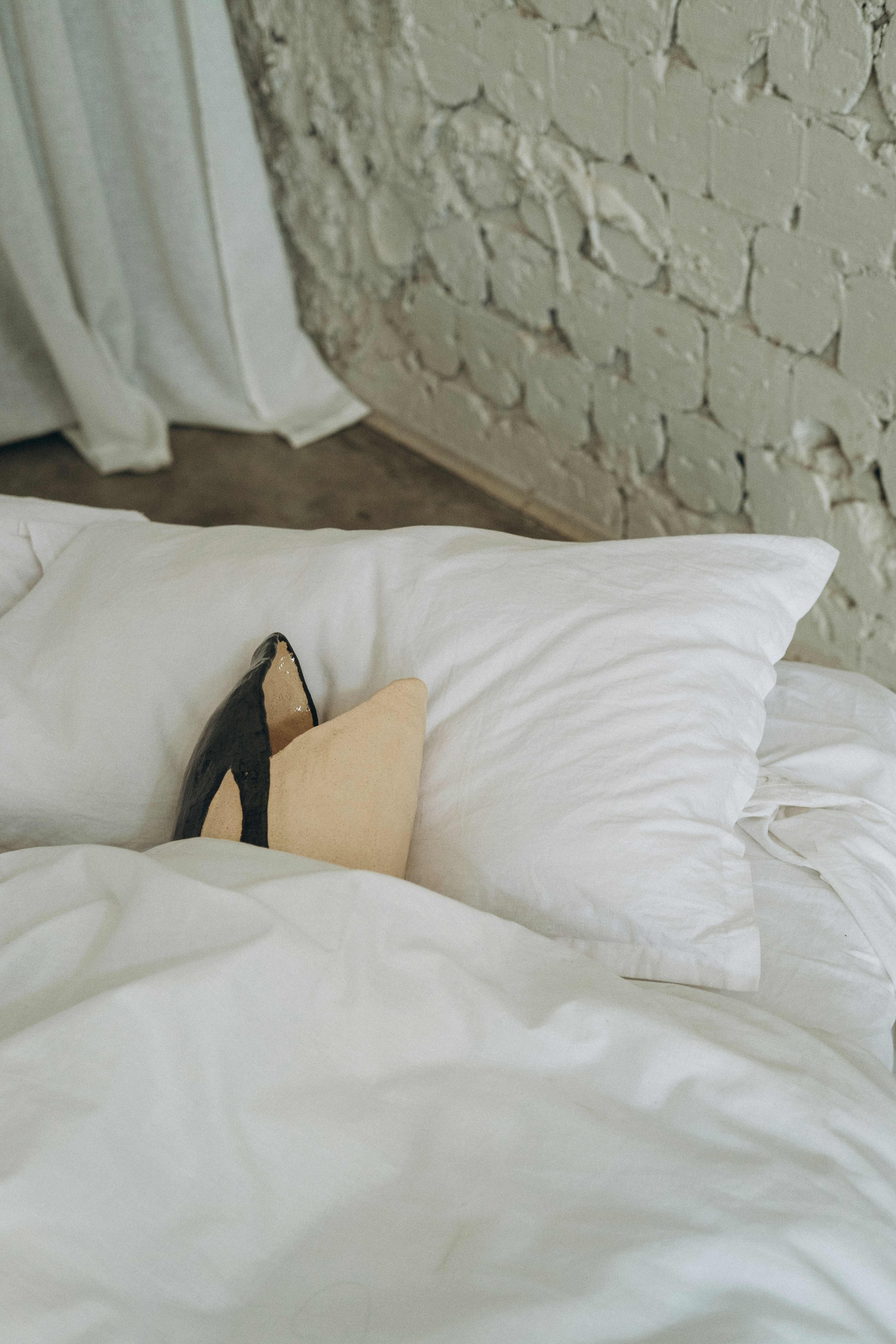 Hidden Heels on a Dreamy Bed