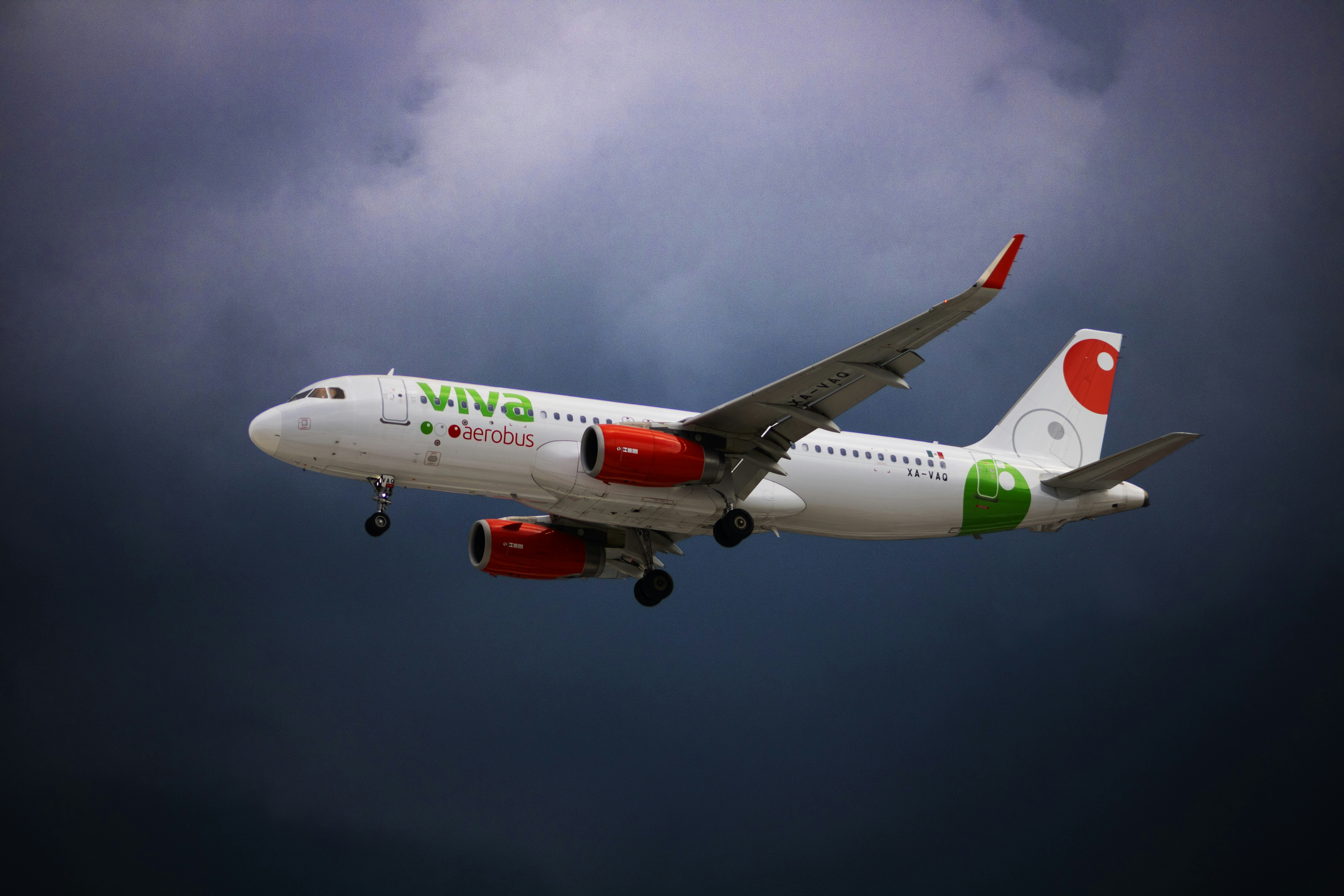 Viva Air in Flight: A Hazy Descent Against Storm-Driven Skies