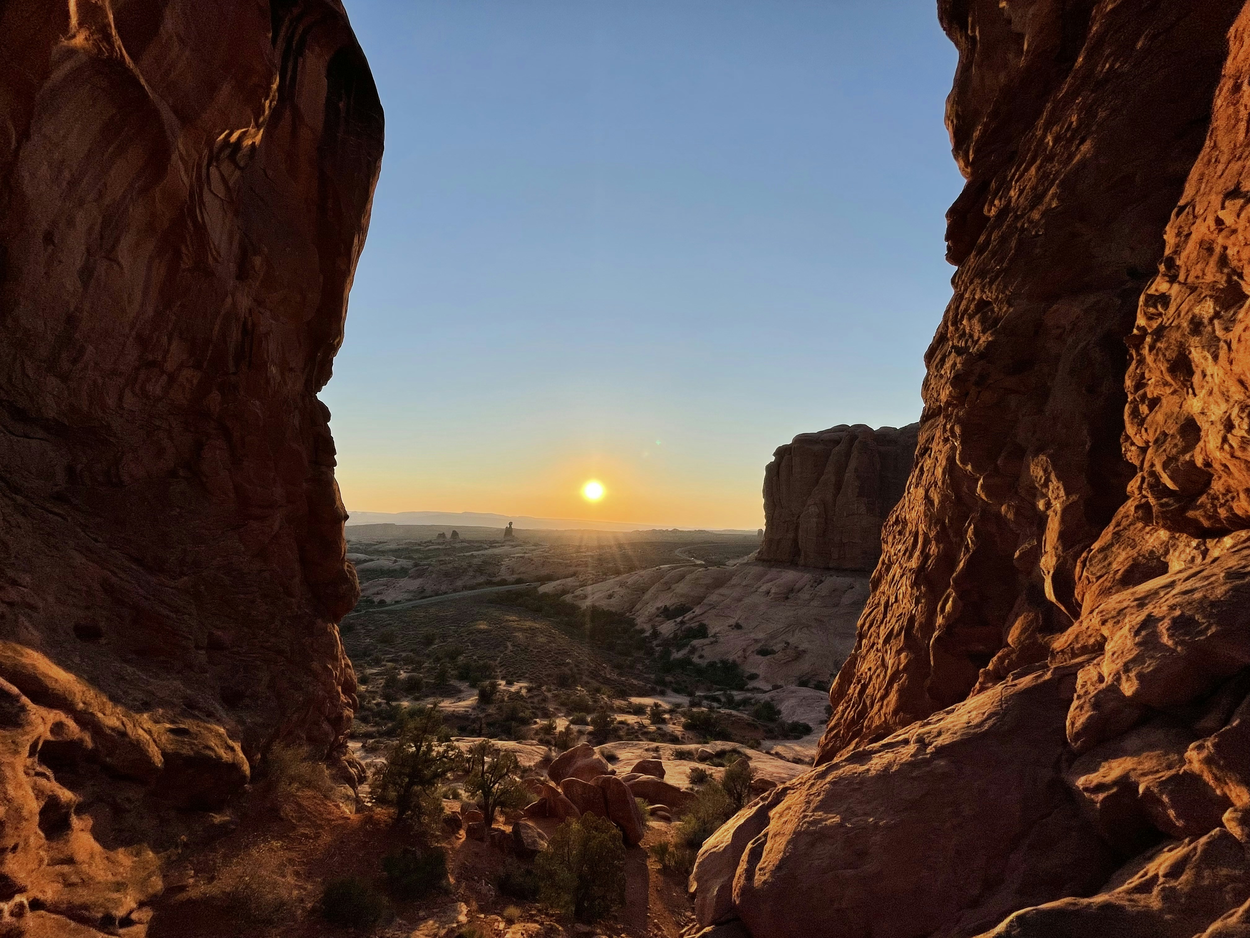 Gateways of Dawn: Light Between Sandstone Sentinels