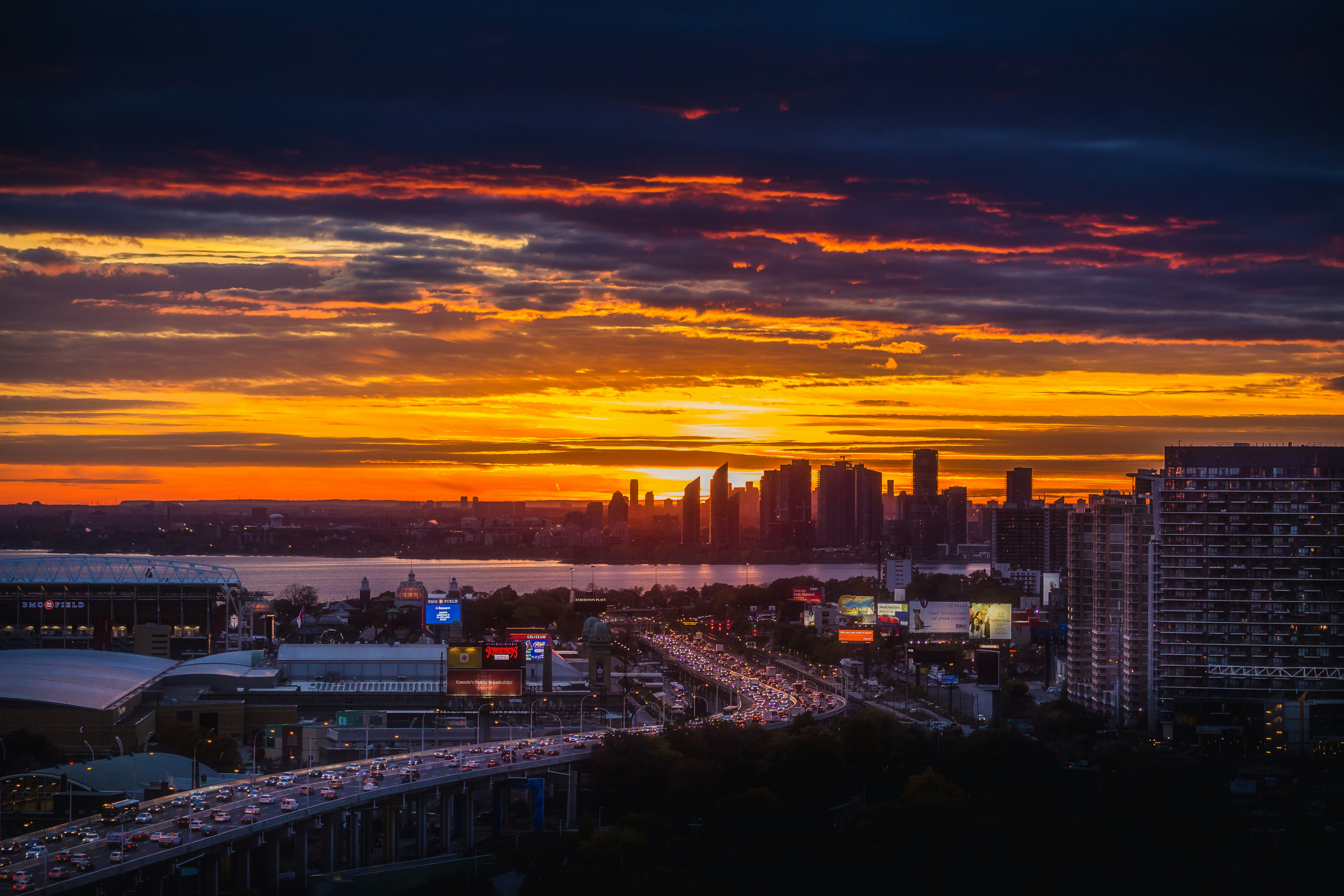 Molten Horizon Over the City Spine: A Freeway Ribbon Glows at Dusk